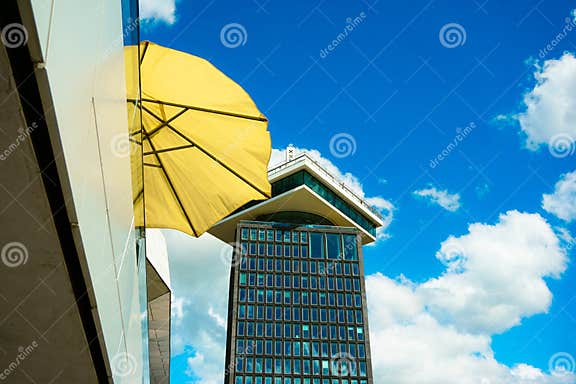 A Parasol in Front of a Tall Building Editorial Photography - Image of ...