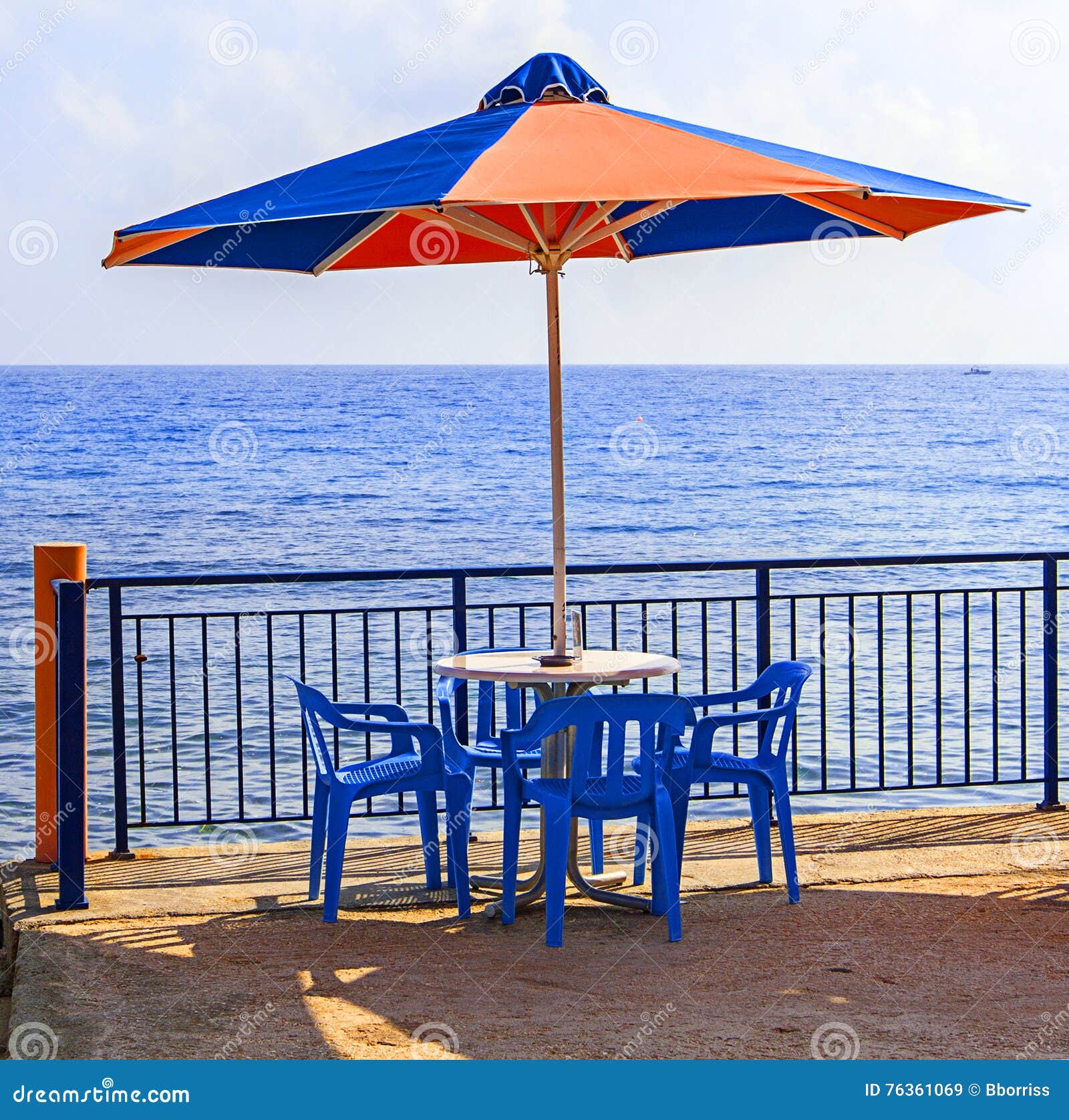 Parasol and Table in the Cafe on the Banks Stock Image - Image of ocean ...