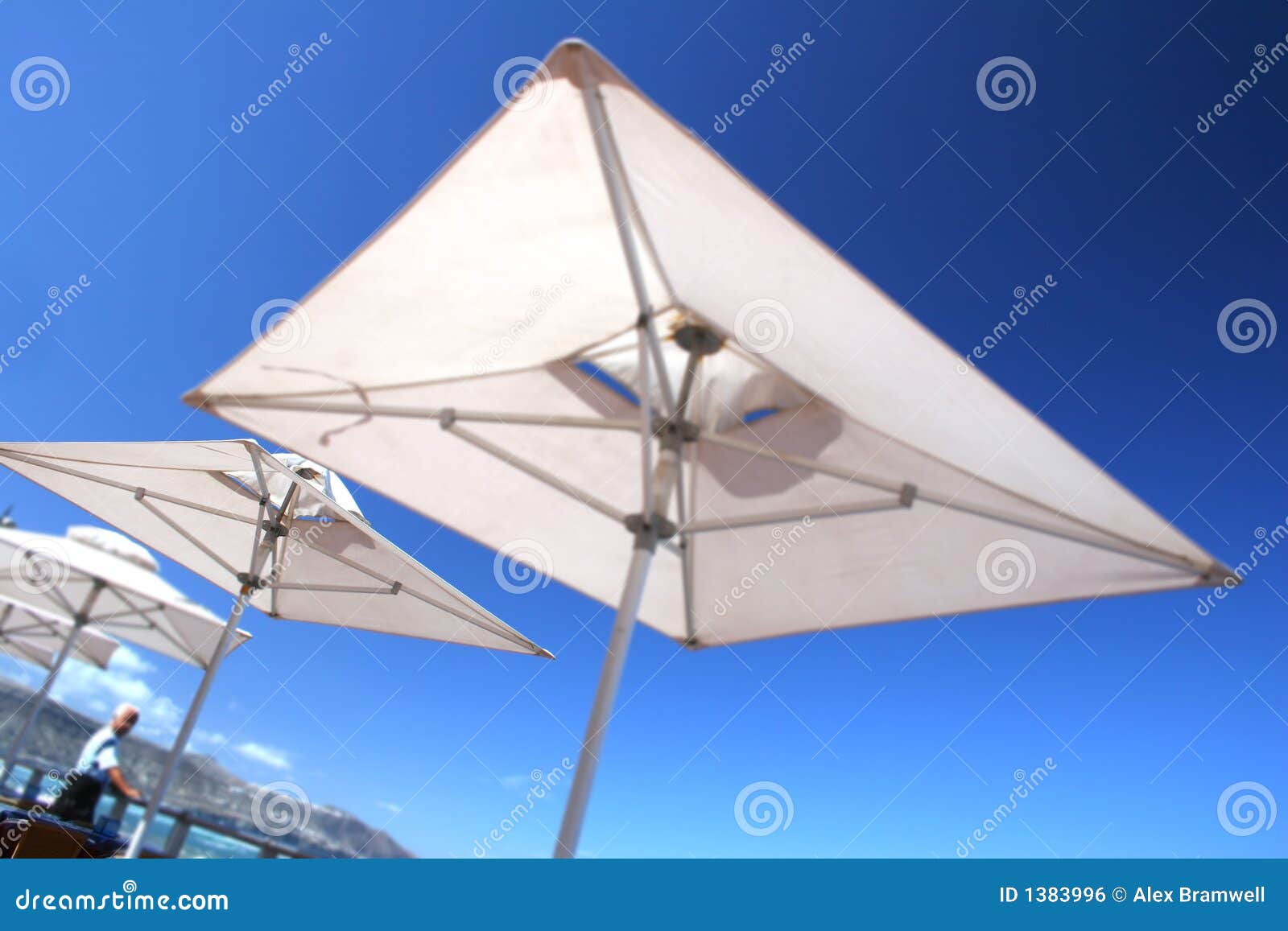 Parasols stock photo. Image of water, beach, parasol, coast - 1383996