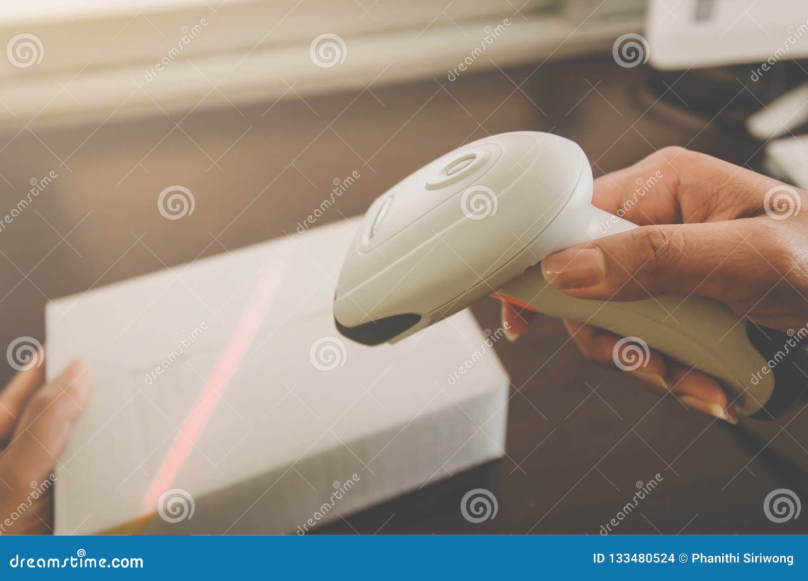 A Human Hand Holding Parcel with Barcode Reader for Delivery Stock ...