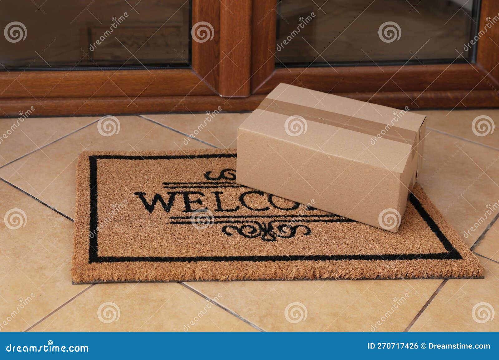 Parcel Delivered on Mat Near Front Door Stock Photo - Image of courier ...