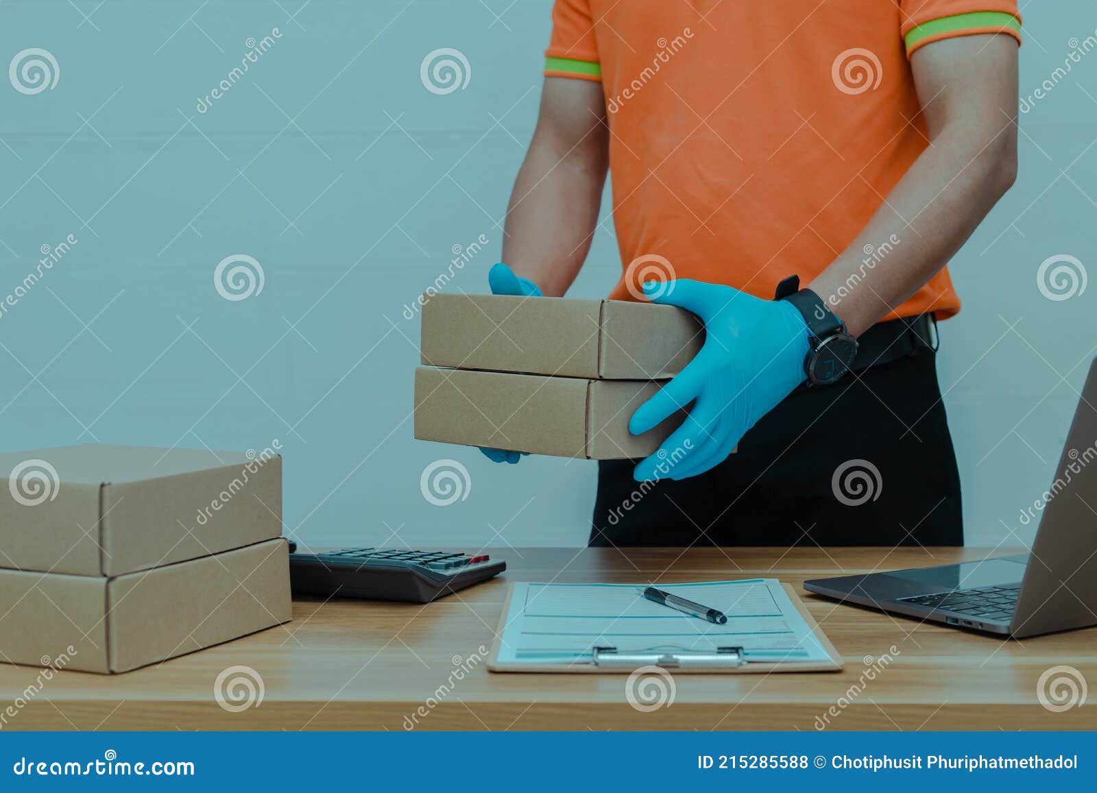 A Parcel Delivery Worker Counting the Parcel Boxes Stock Photo - Image ...