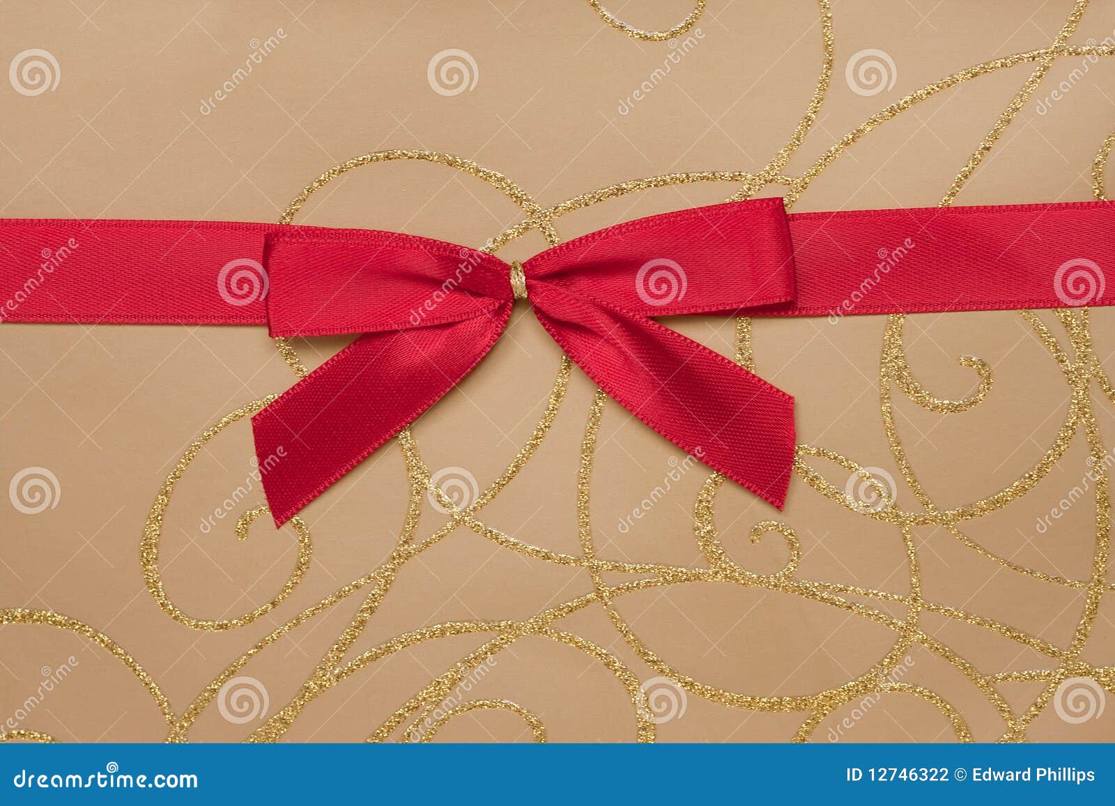 Parcel with Gold Paper and Red Ribbon Stock Photo - Image of paper ...