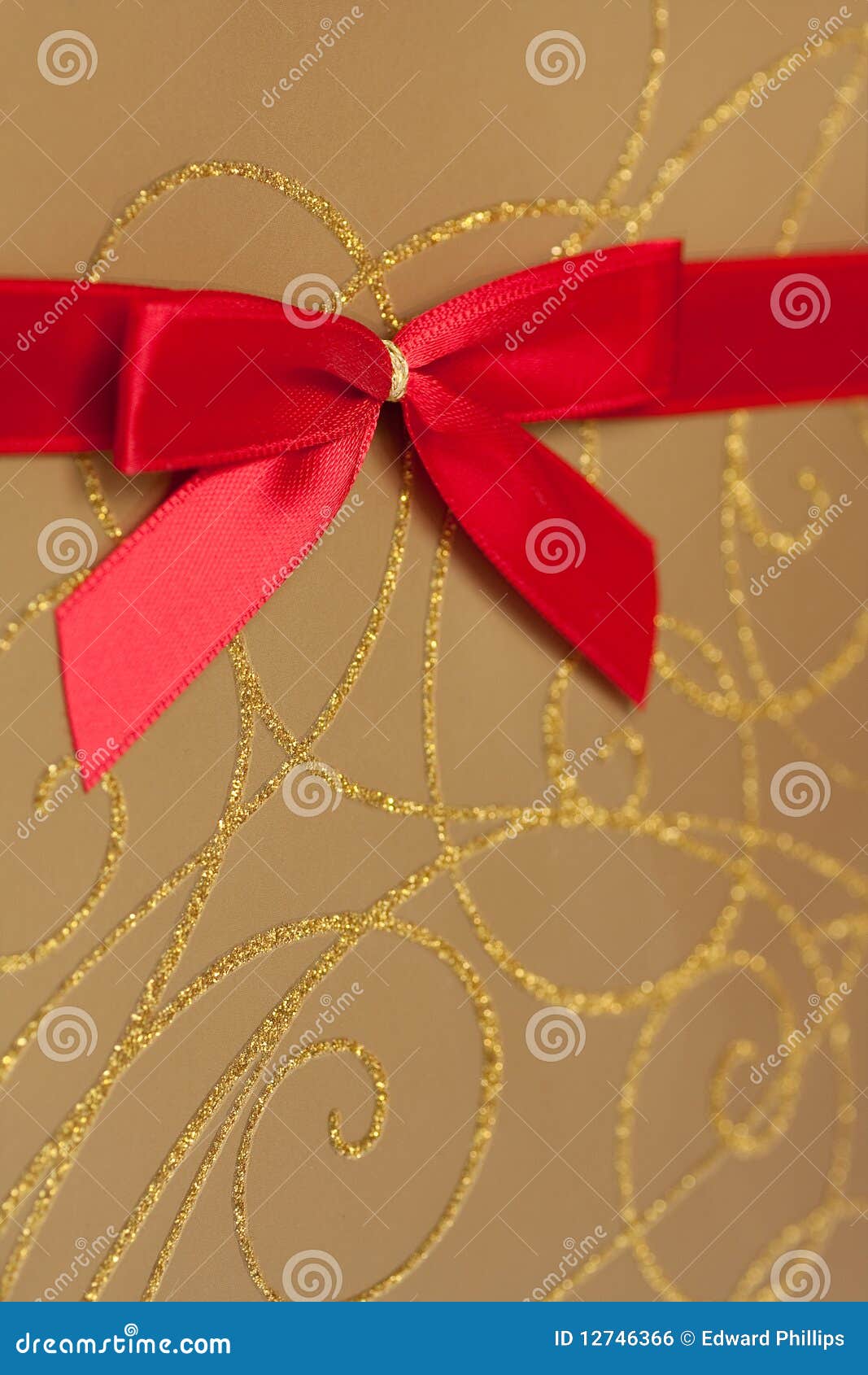 Parcel with Gold Paper and Red Ribbon Stock Photo - Image of colourful ...