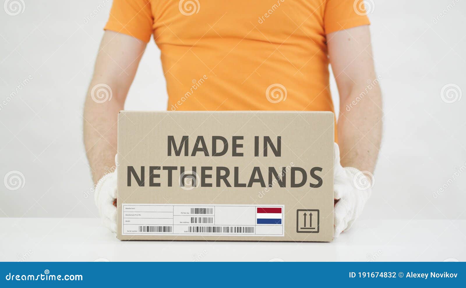 Parcel with MADE in NETHERLANDS Text and Warehouse Worker Stock Photo ...
