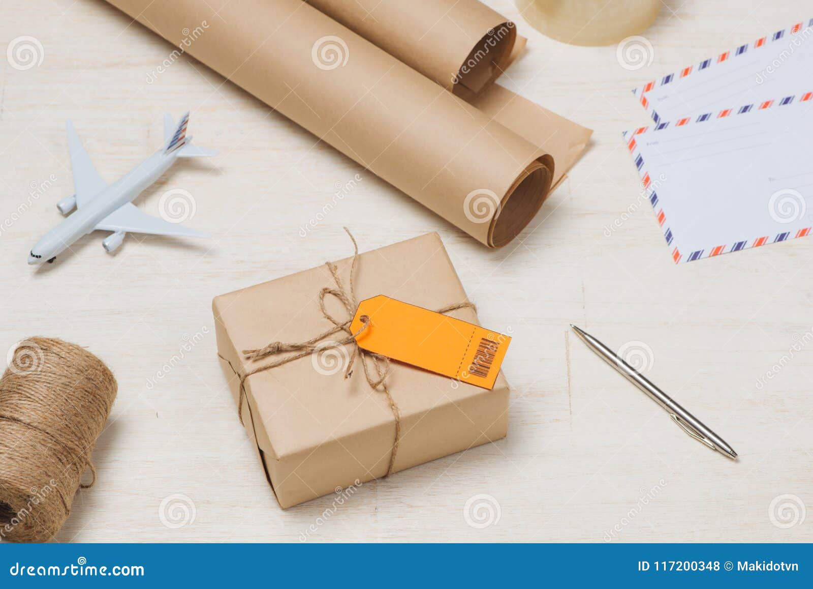 Parcel Tied with String with Address Orange Label Attached Stock Photo ...