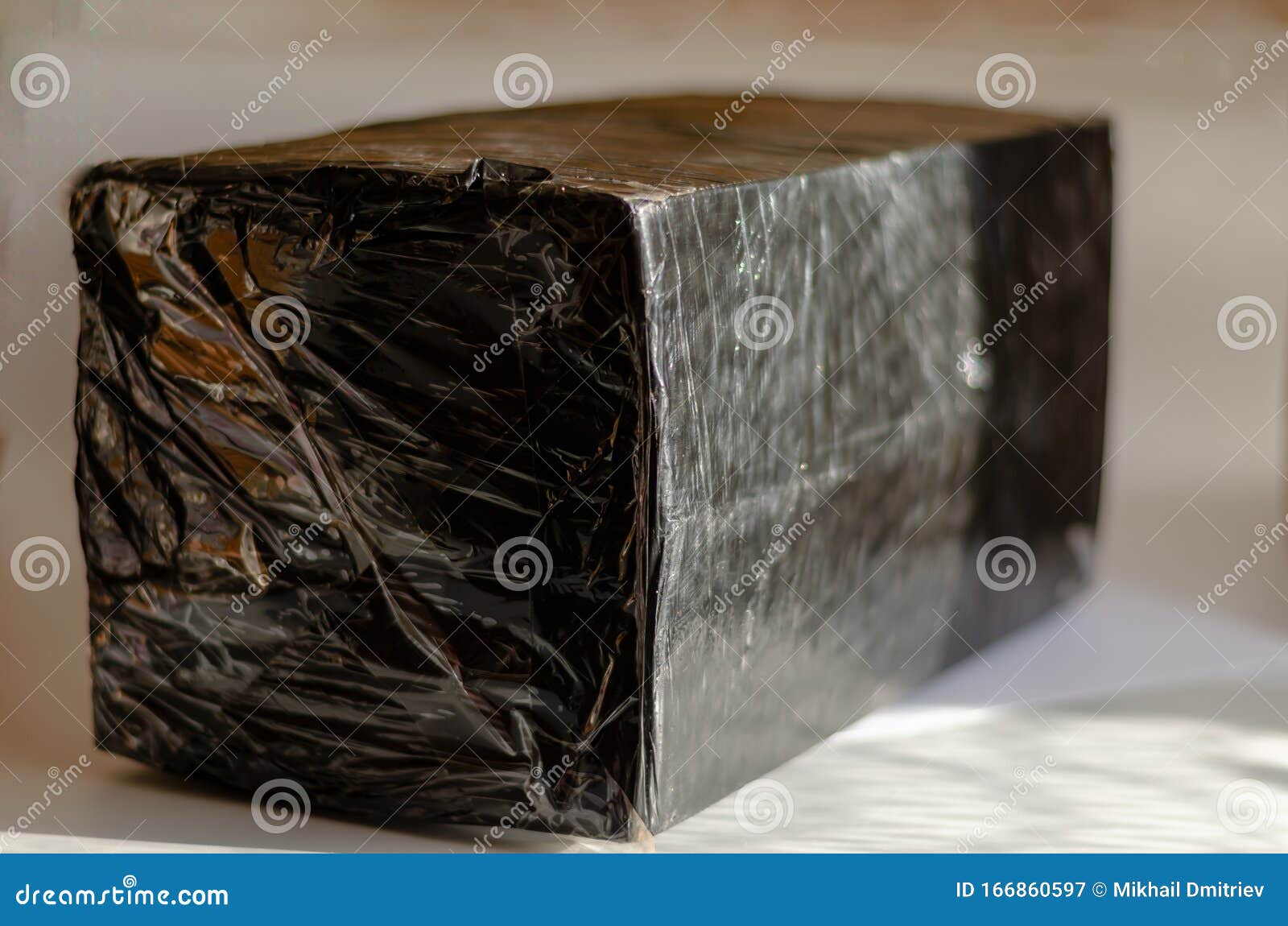 Parcel Wrapped in Black Packaging Film. Stock Image - Image of flowing ...