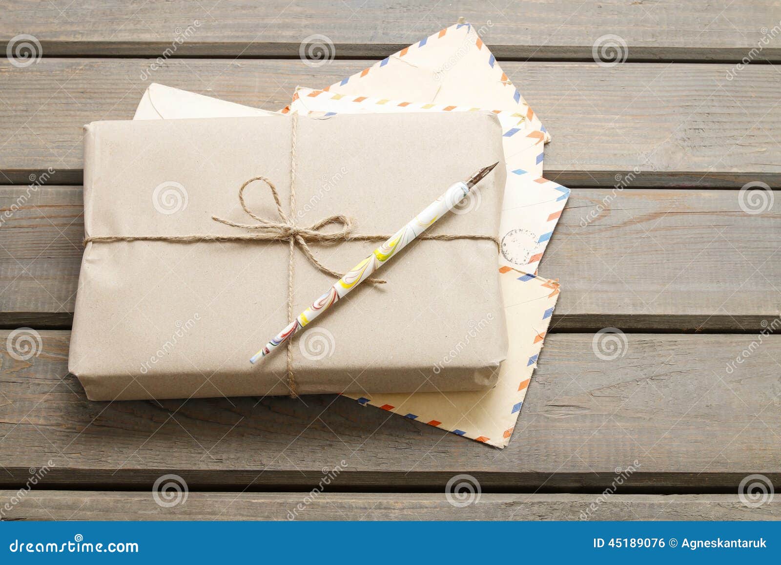 Parcel Wrapped with Brown Paper on Table Stock Photo - Image of ...
