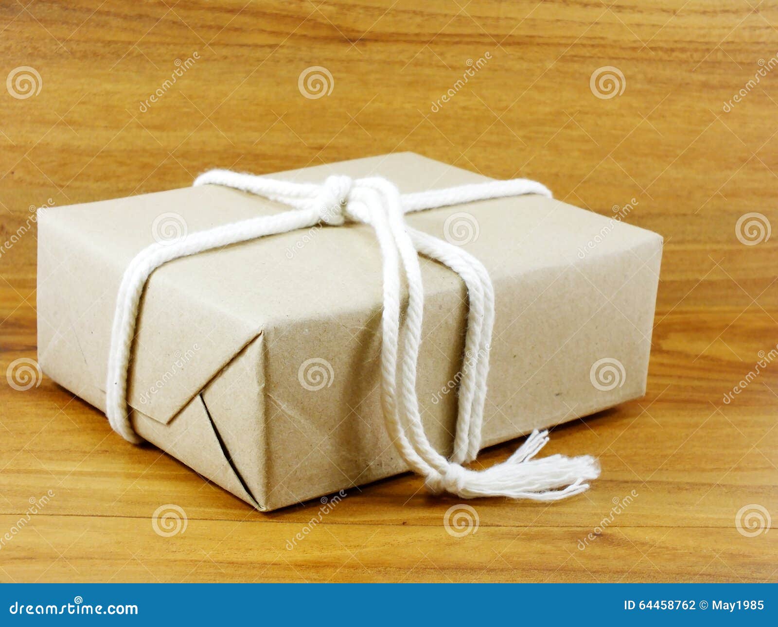 Parcel Wrapped in Brown Paper Stock Photo - Image of carton, fragile ...