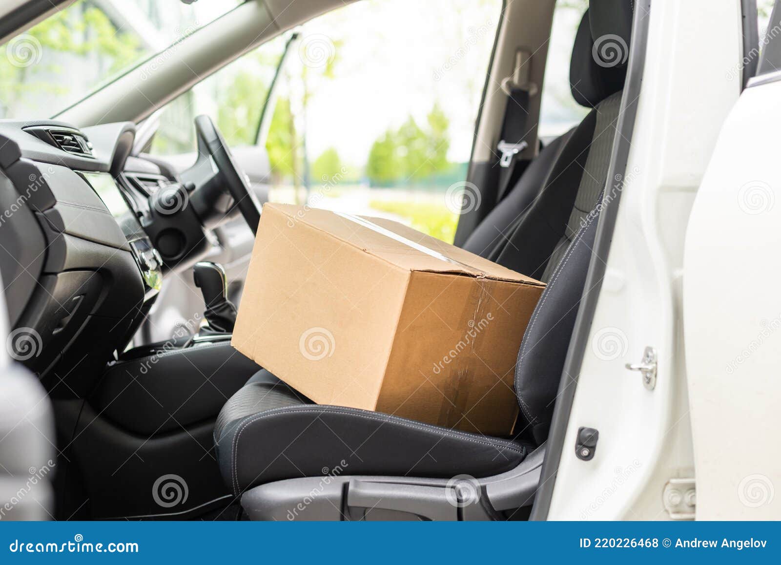 Parcels in Delivery Car. Driving with Parcels Stock Photo - Image of ...