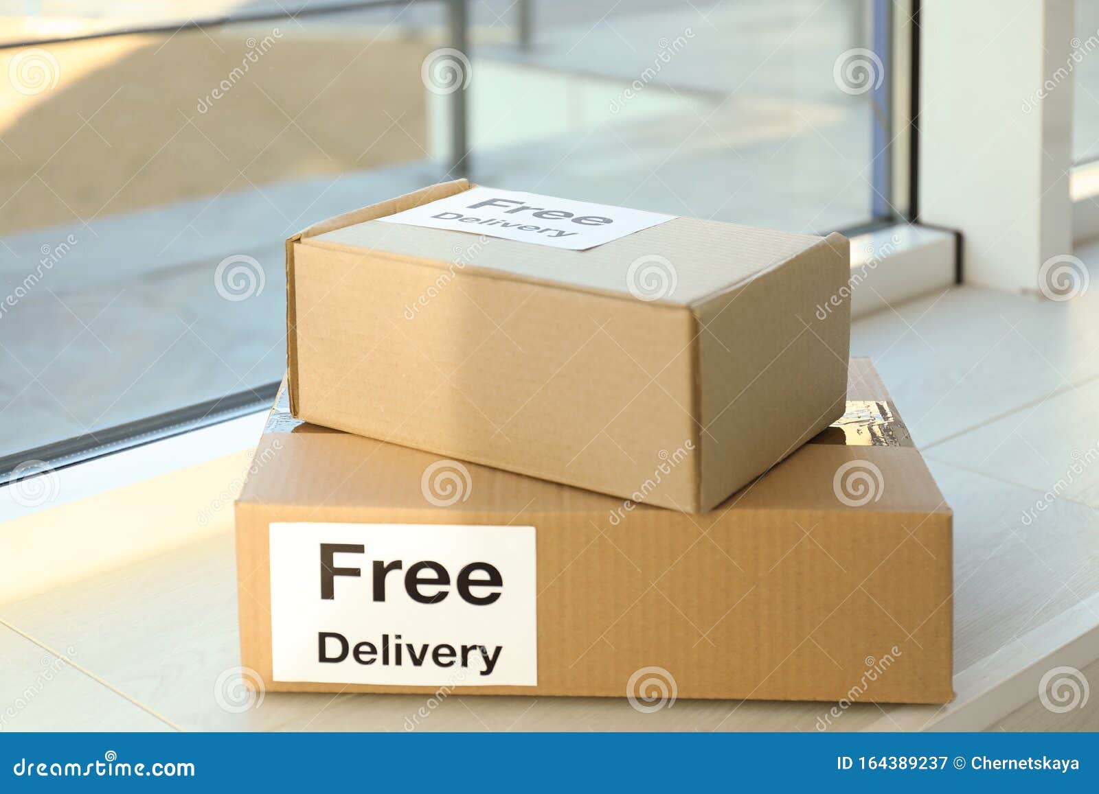 Parcels with Sticker Free Delivery on Window Sill Stock Image - Image ...