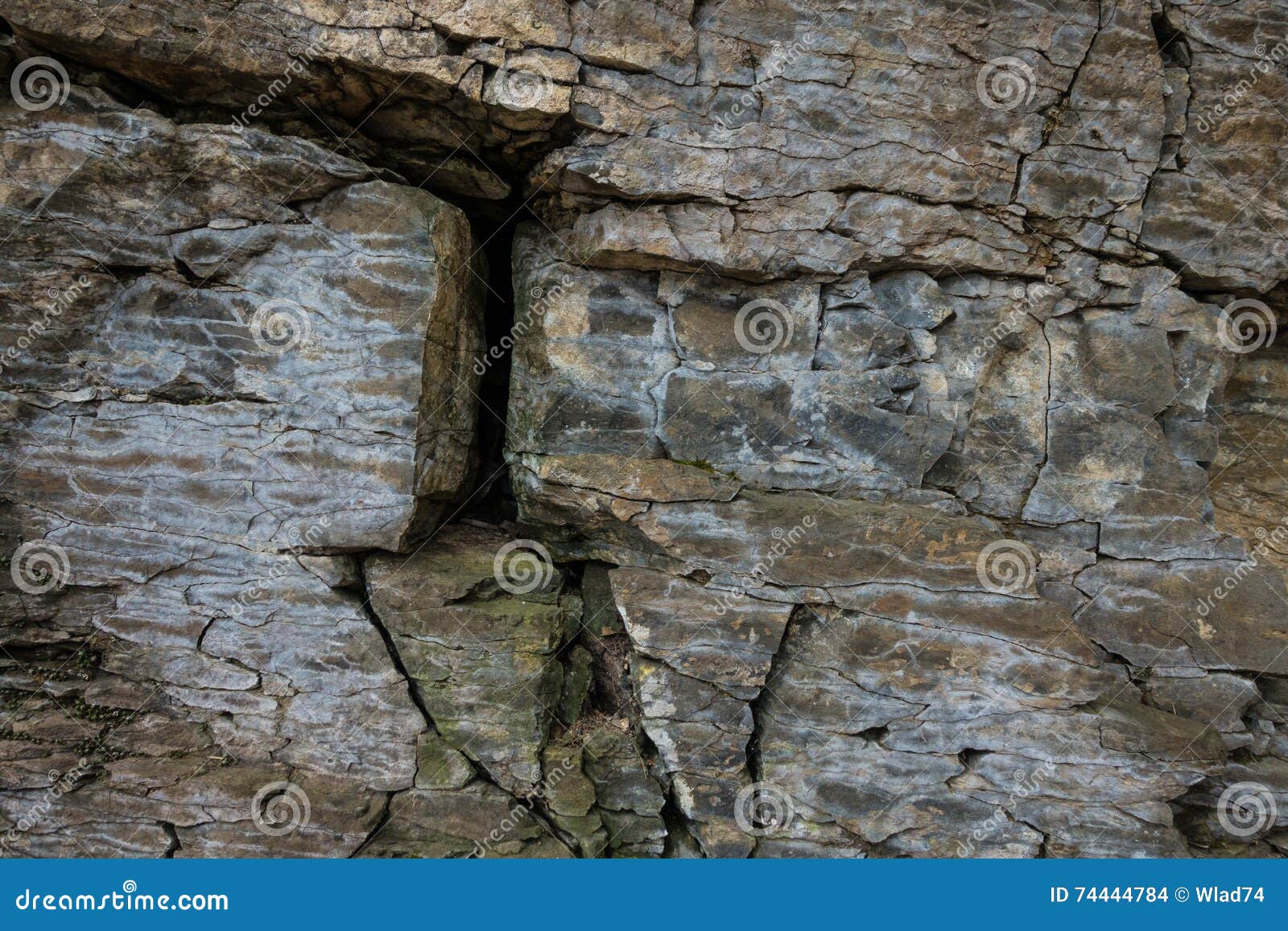 Pared De Piedra De La Roca Con Las Grietas Foto de archivo - Imagen de ...