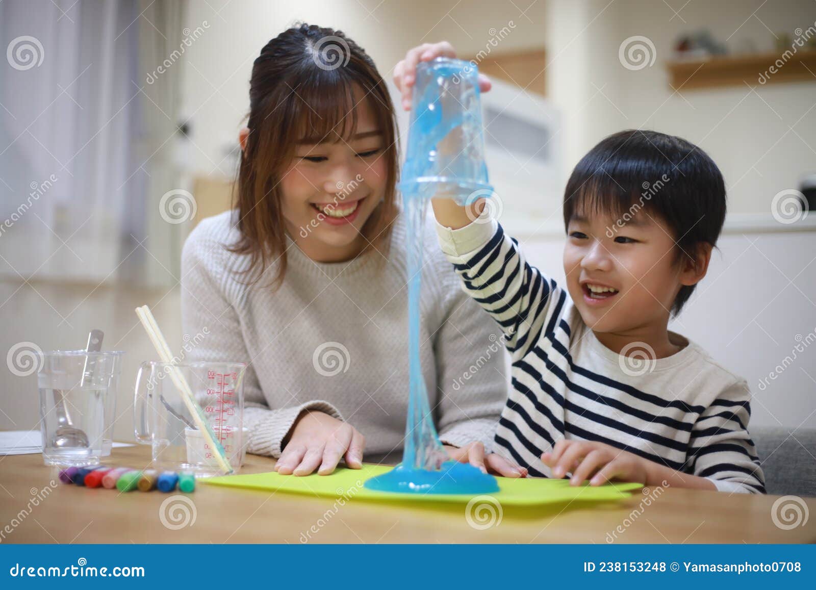 Parent and Child Making Slime Stock Photo - Image of mother, parenting ...