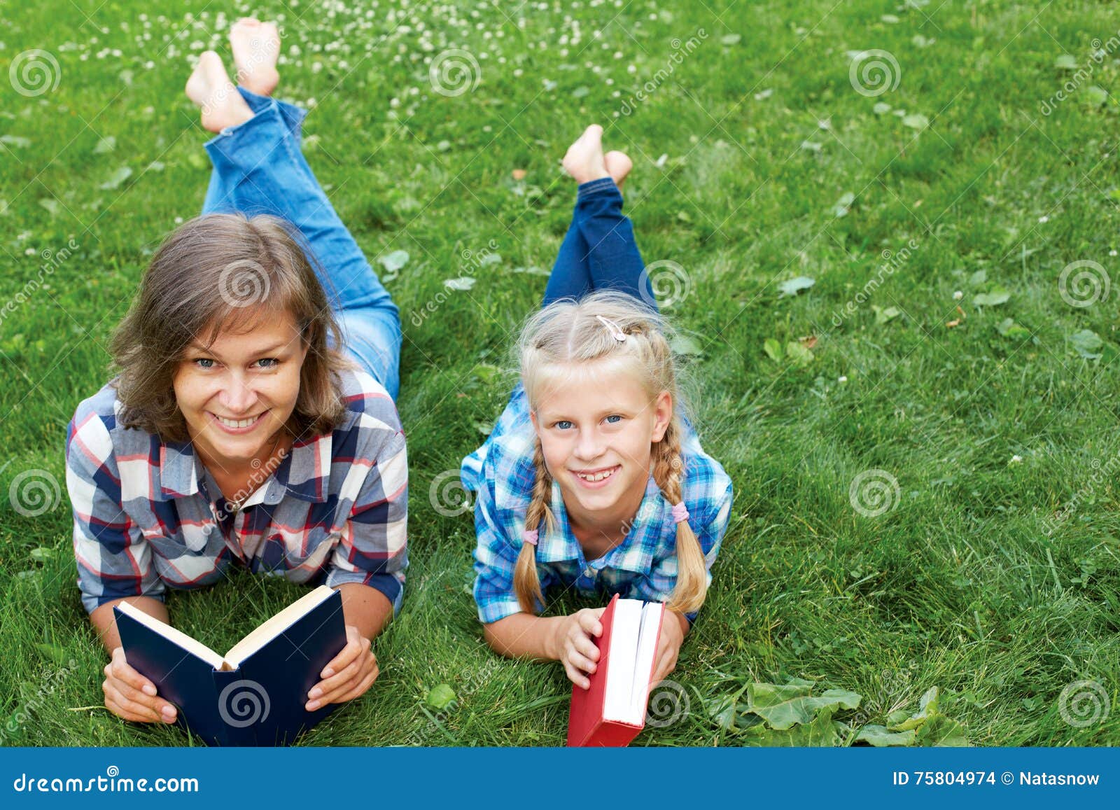 Parent and Child Reading Books Together in the Park Stock Photo - Image ... Parent and Child Reading Books Together in the Park Stock Photo - Image ...