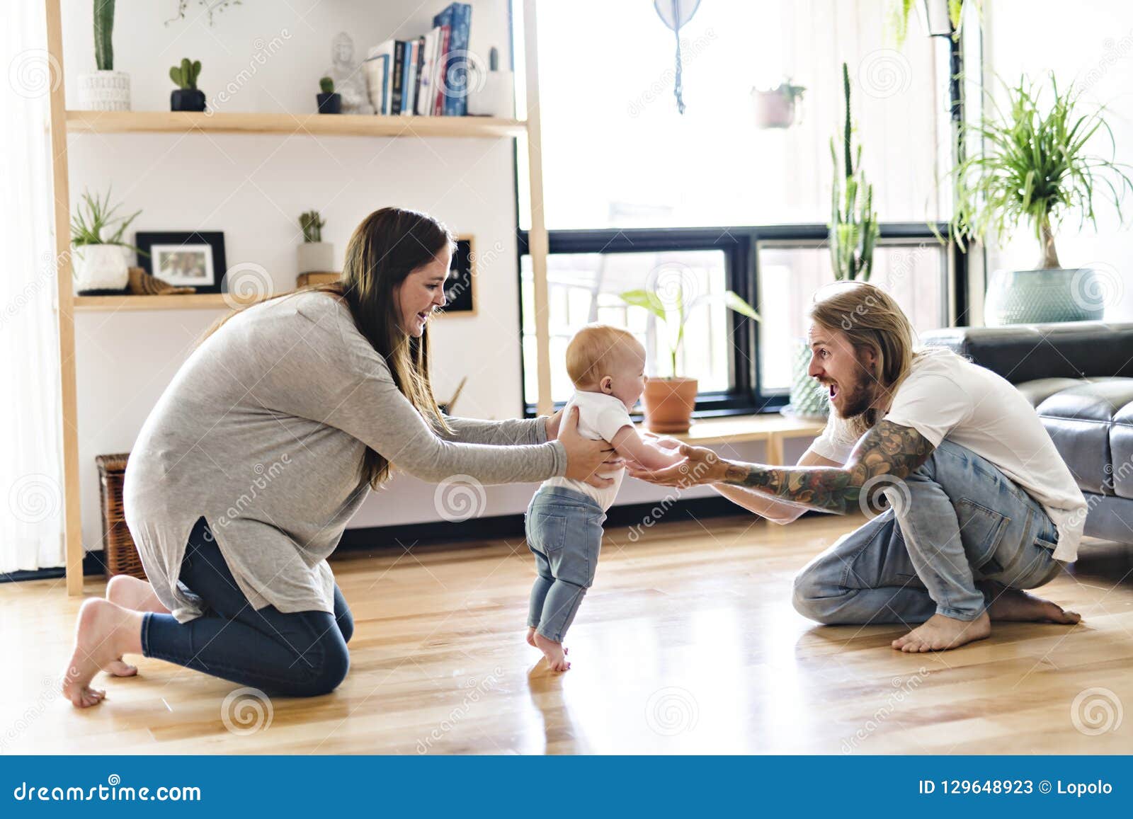 Parent Help Baby Daughter Take First Steps at Home Stock Image - Image ...