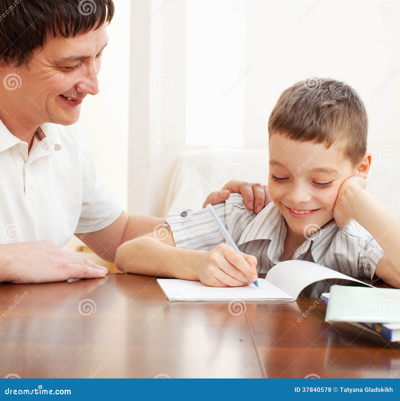 Parent helps his child stock photo. Image of studying - 37840578