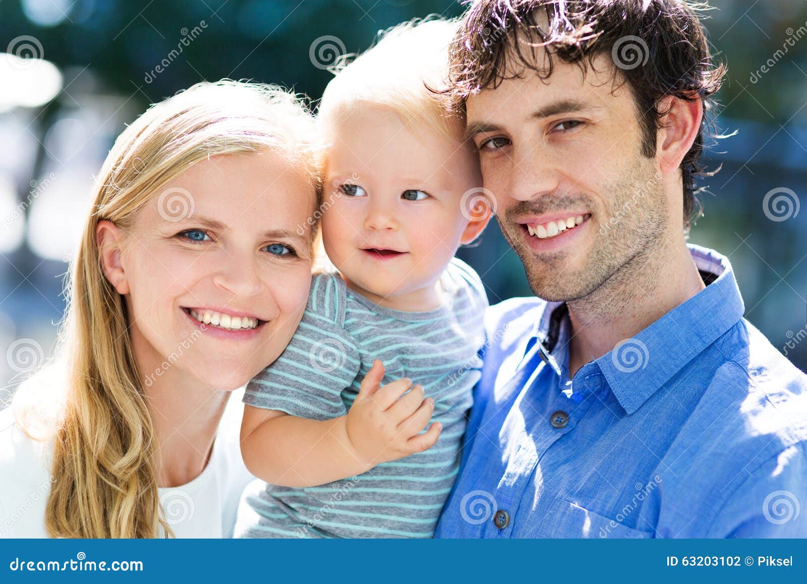 Parents with baby boy stock photo. Image of embracing - 63203102