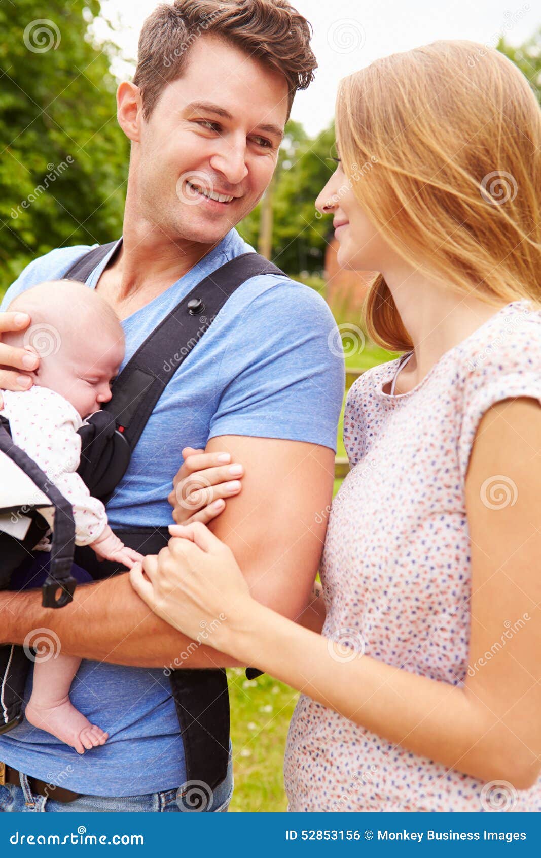 Parents with Baby in Carrier on Walk in Countryside Stock Photo - Image ...