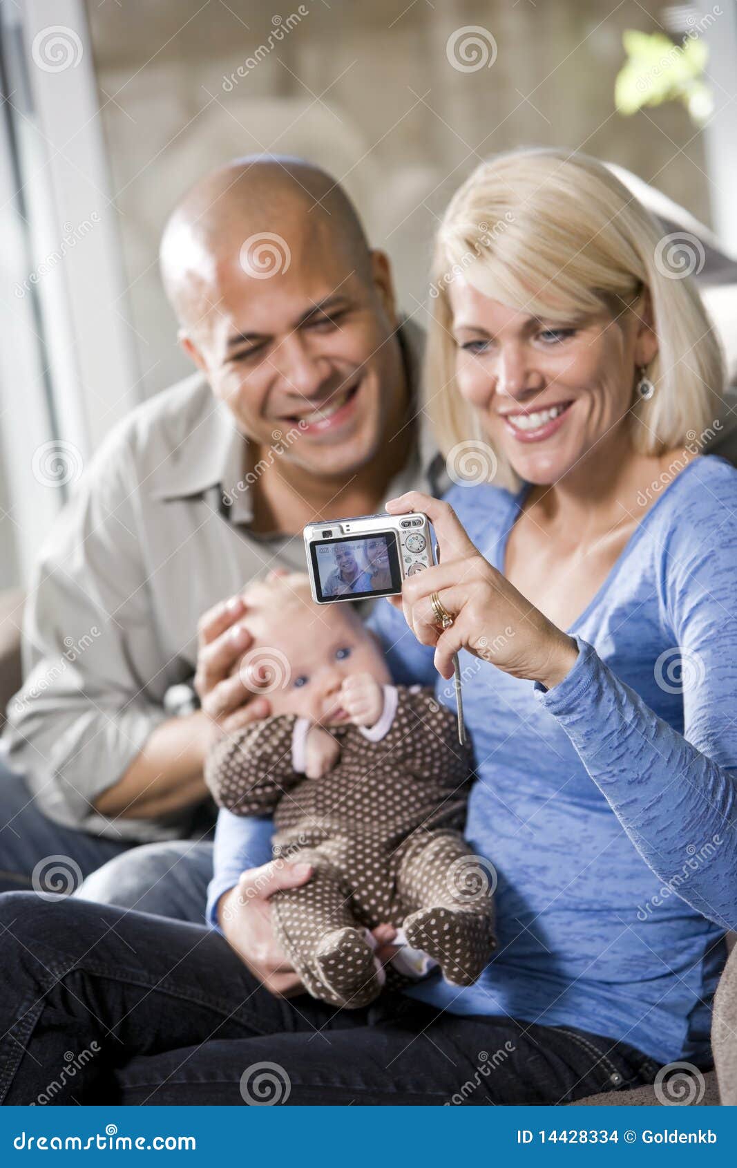 Parents with Baby at Home, Mom Holding Camera Stock Photo - Image of ...