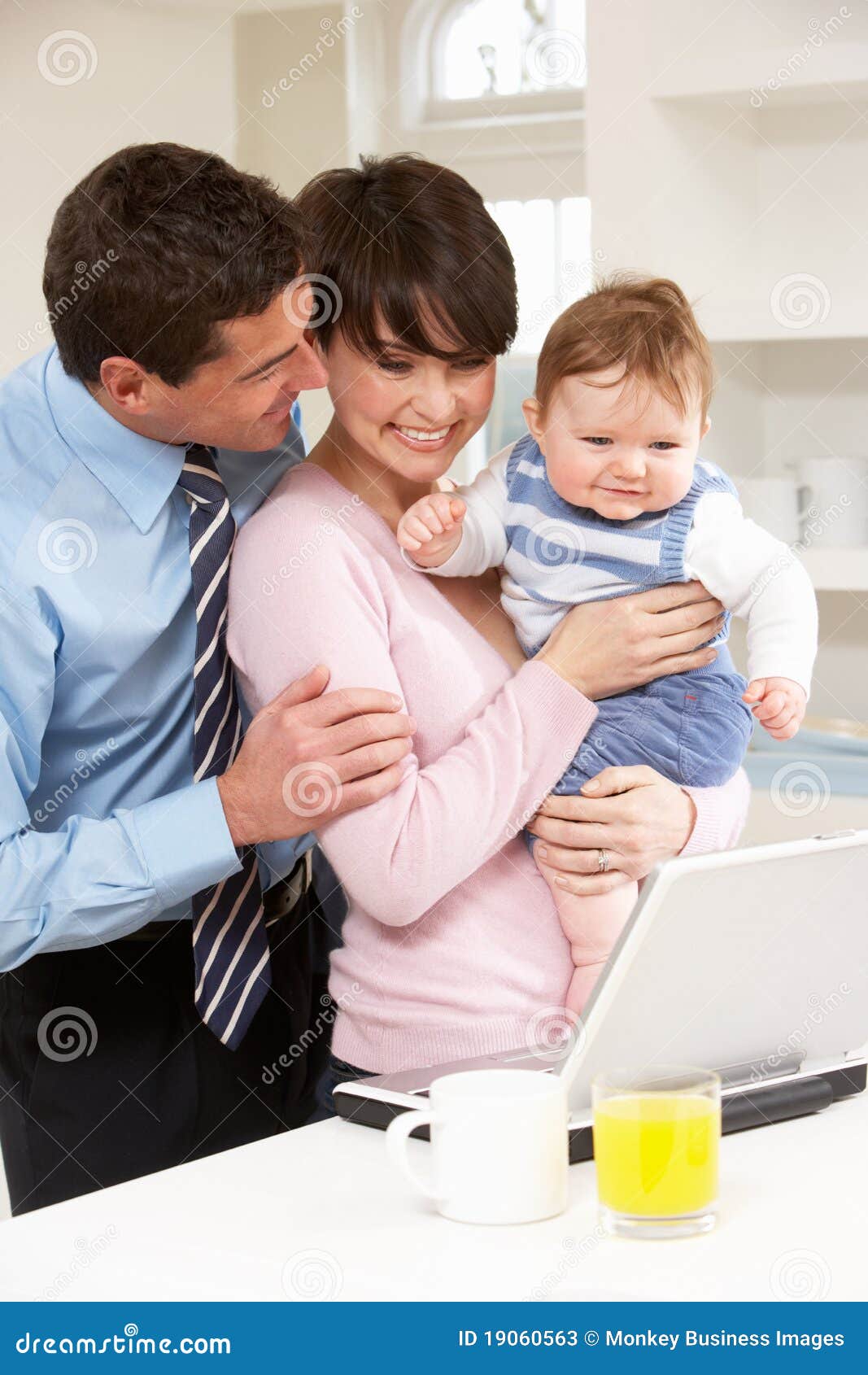 Parents with Baby Working from Home Using Laptop Stock Image - Image of ...