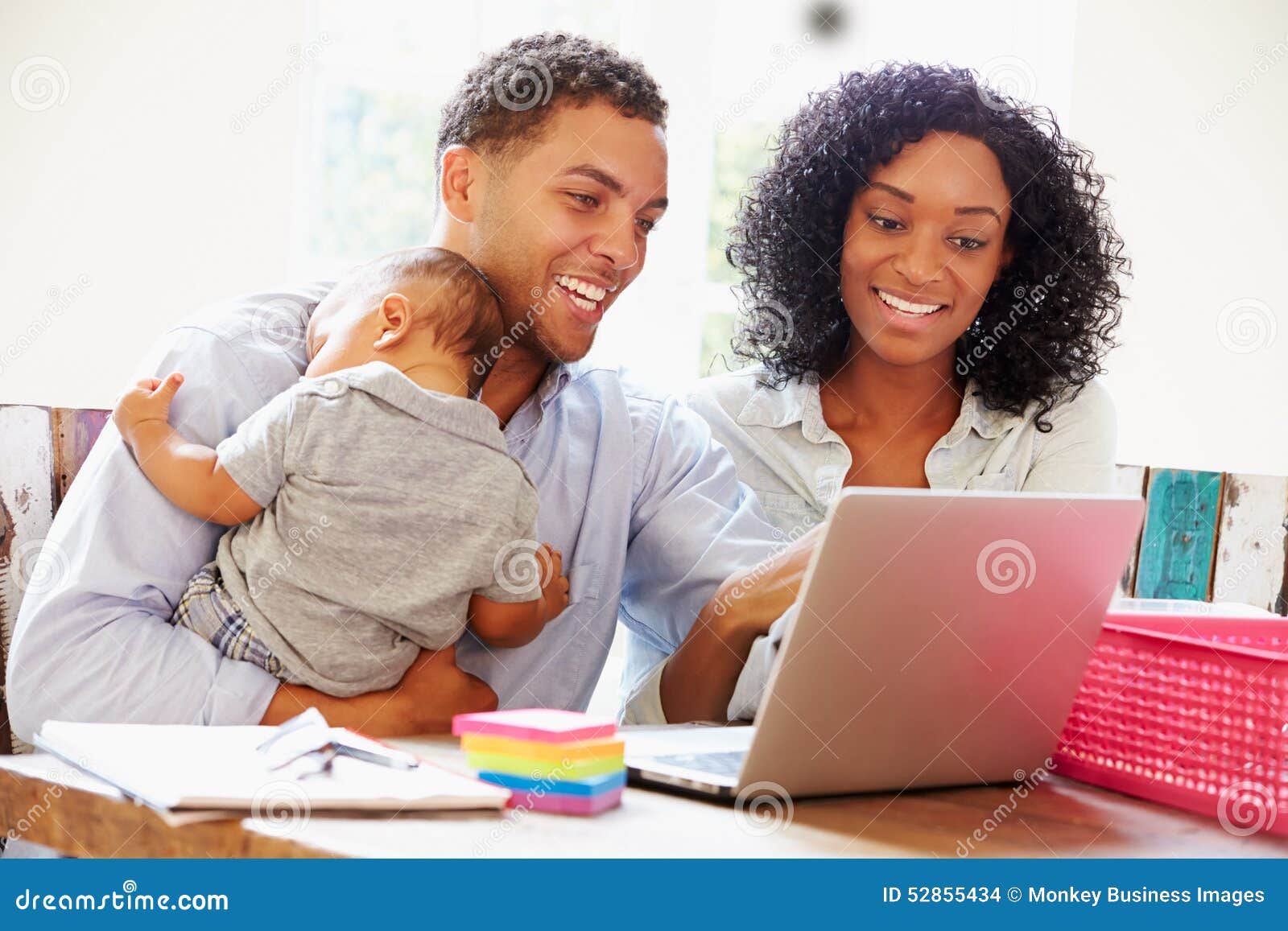 Parents with Baby Working in Office at Home Stock Photo - Image of ...