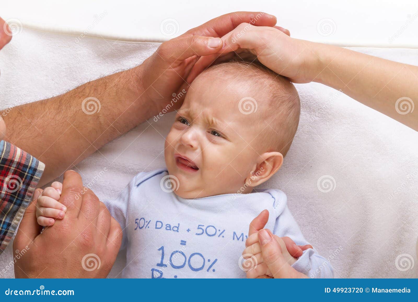 Parents calm a crying baby stock photo. Image of human - 49923720