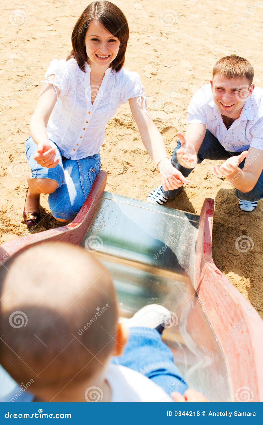 Parents catching their son stock photo. Image of father - 9344218