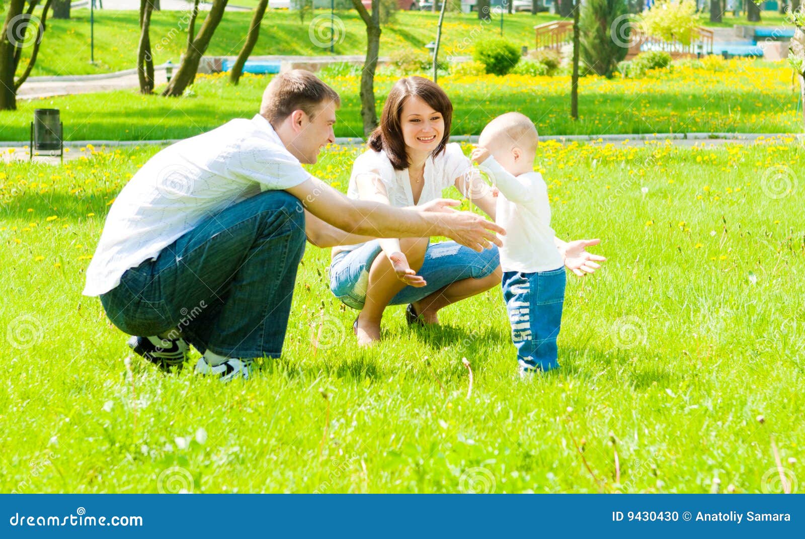 Parents catching their son stock photo. Image of adorable - 9430430