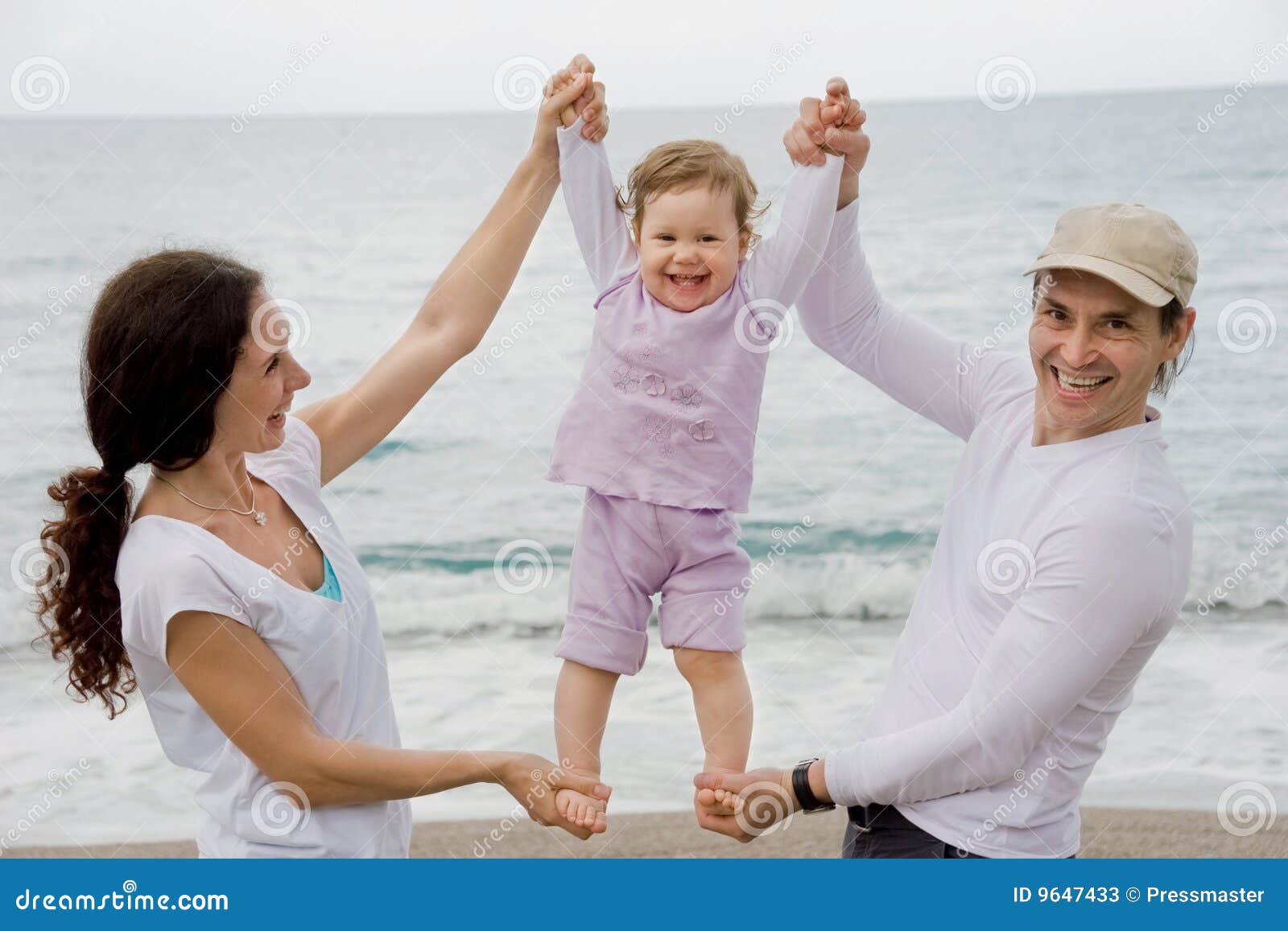 Parents and child stock image. Image of holding, cheerful - 9647433