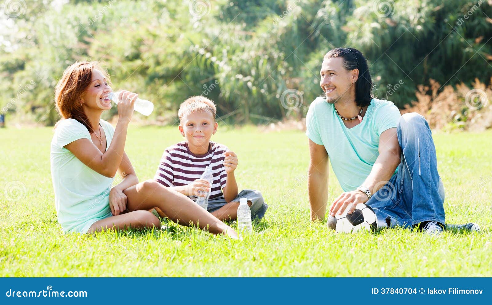 Parents with Child Drinking from Bottles Stock Photo - Image of active ...