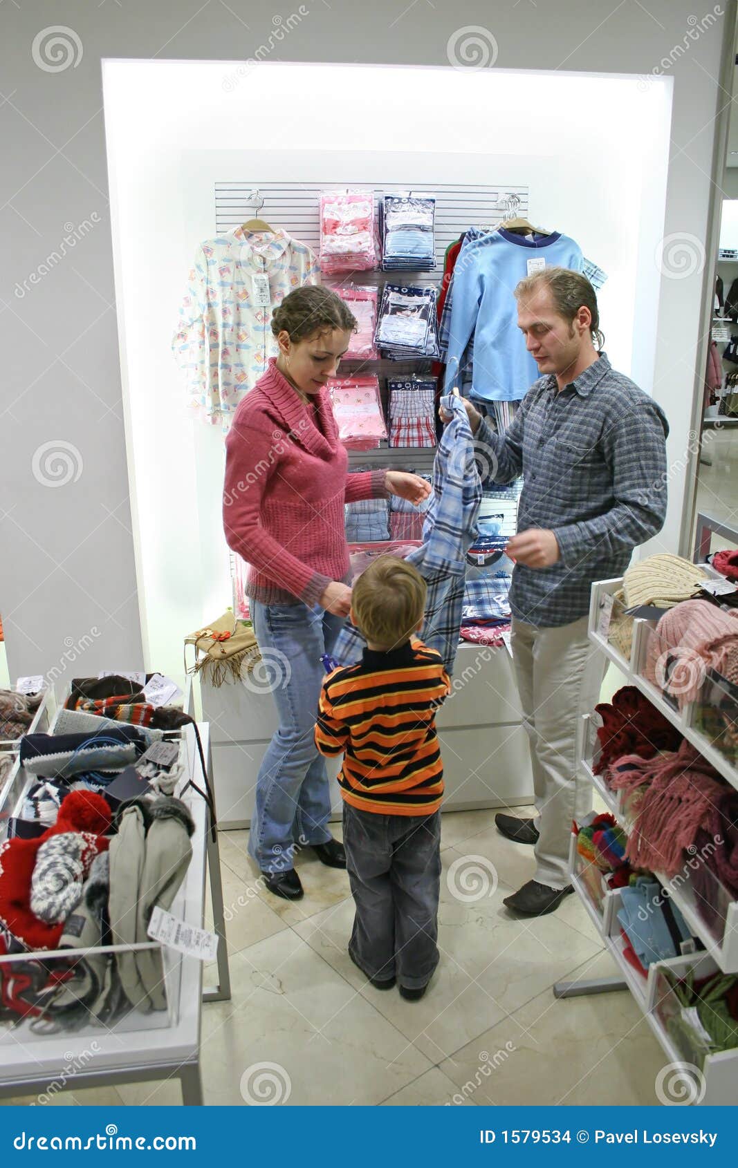 Parents with child in shop stock photo. Image of marketplace - 1579534