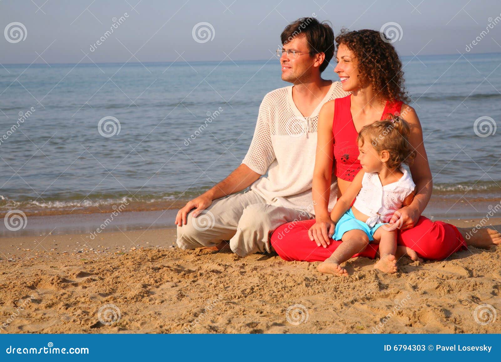 Parents with Child Sitting on Sand on Seashore Stock Image - Image of ...