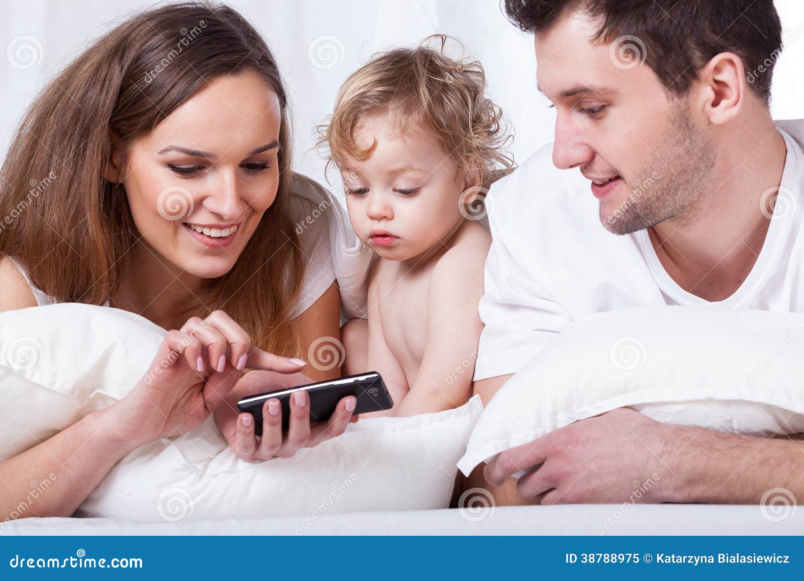 Parents and Child Watching Photos Stock Image - Image of love, laughing ...