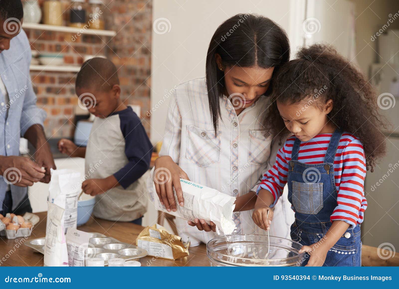 Parents and Children Baking Cakes in Kitchen Together Stock Photo ...