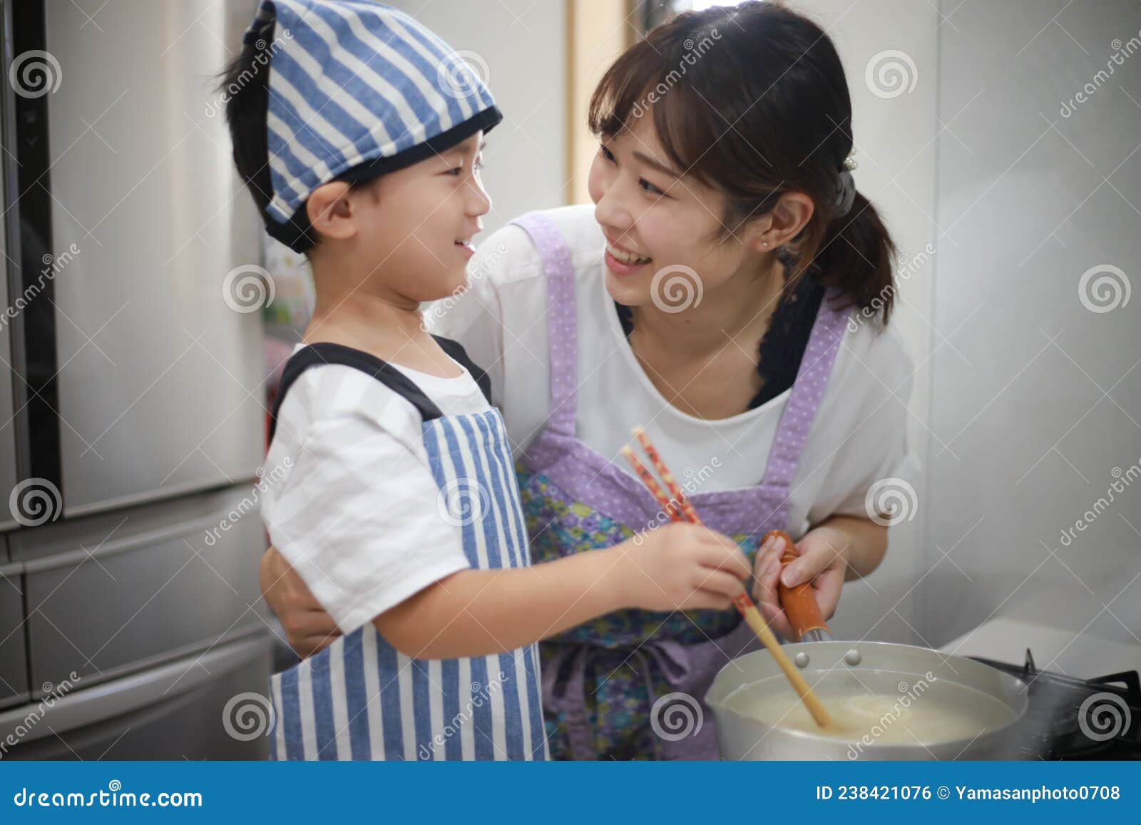 Parents and Children Boiling Somen Stock Photo - Image of cooking ...
