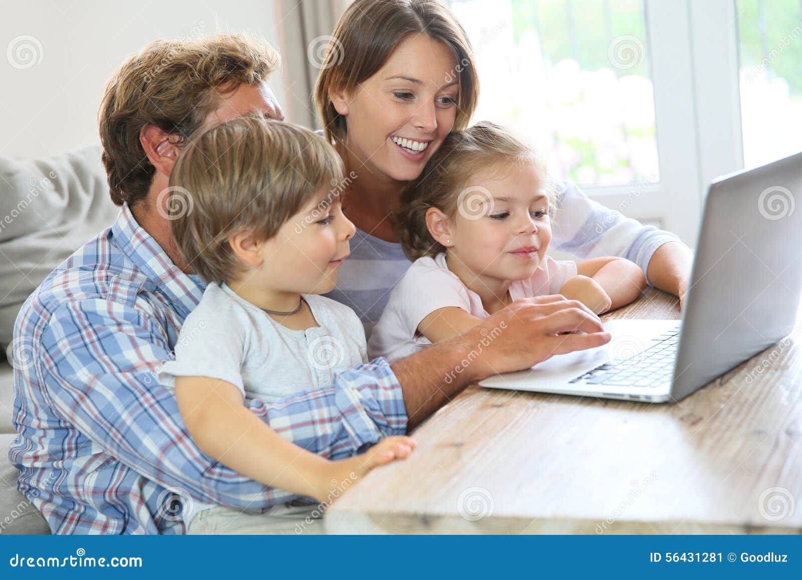 Parents with Children Playing on Laptop Stock Image - Image of woman ...
