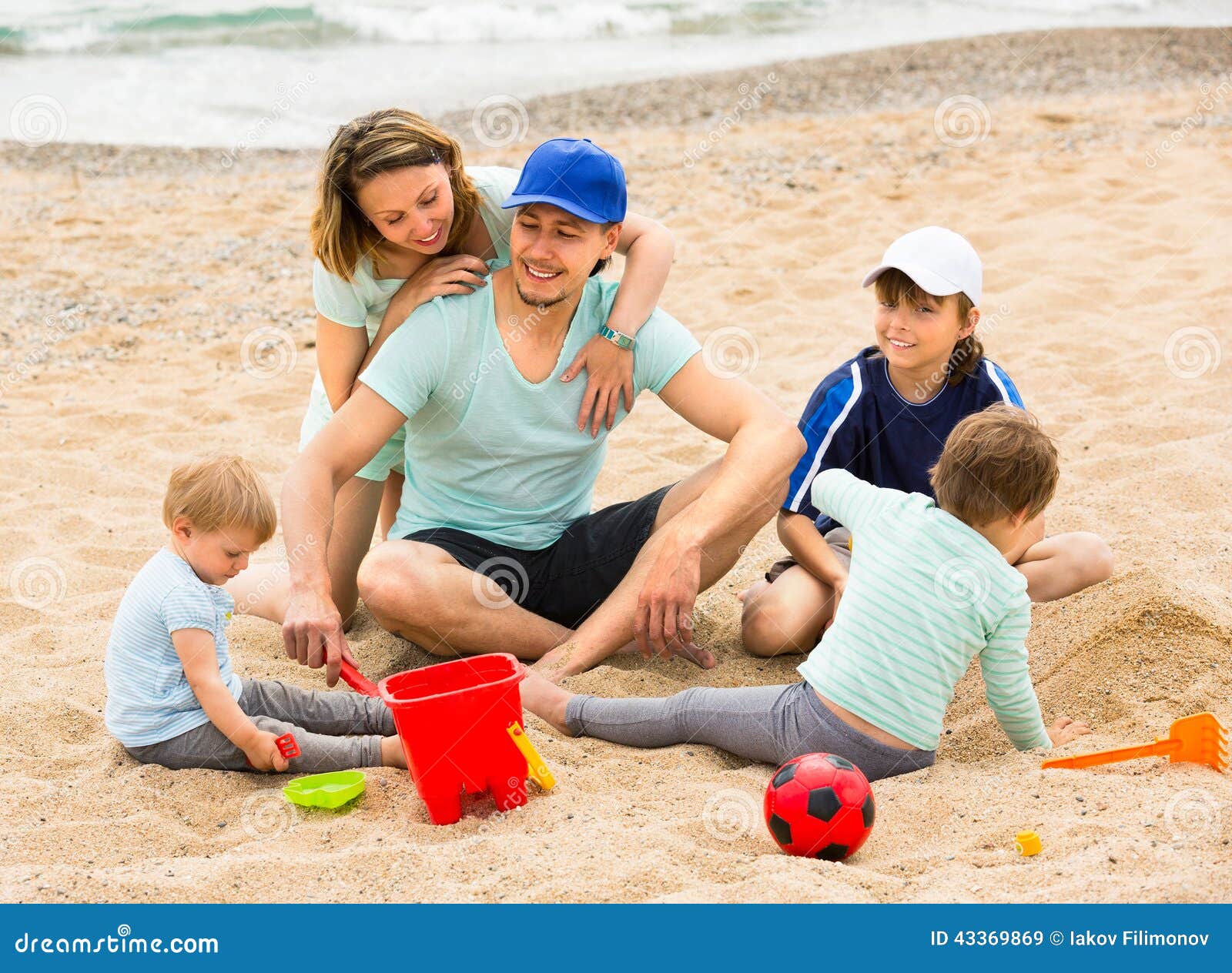 Parents with Children Playing in the Sand Stock Image - Image of ...
