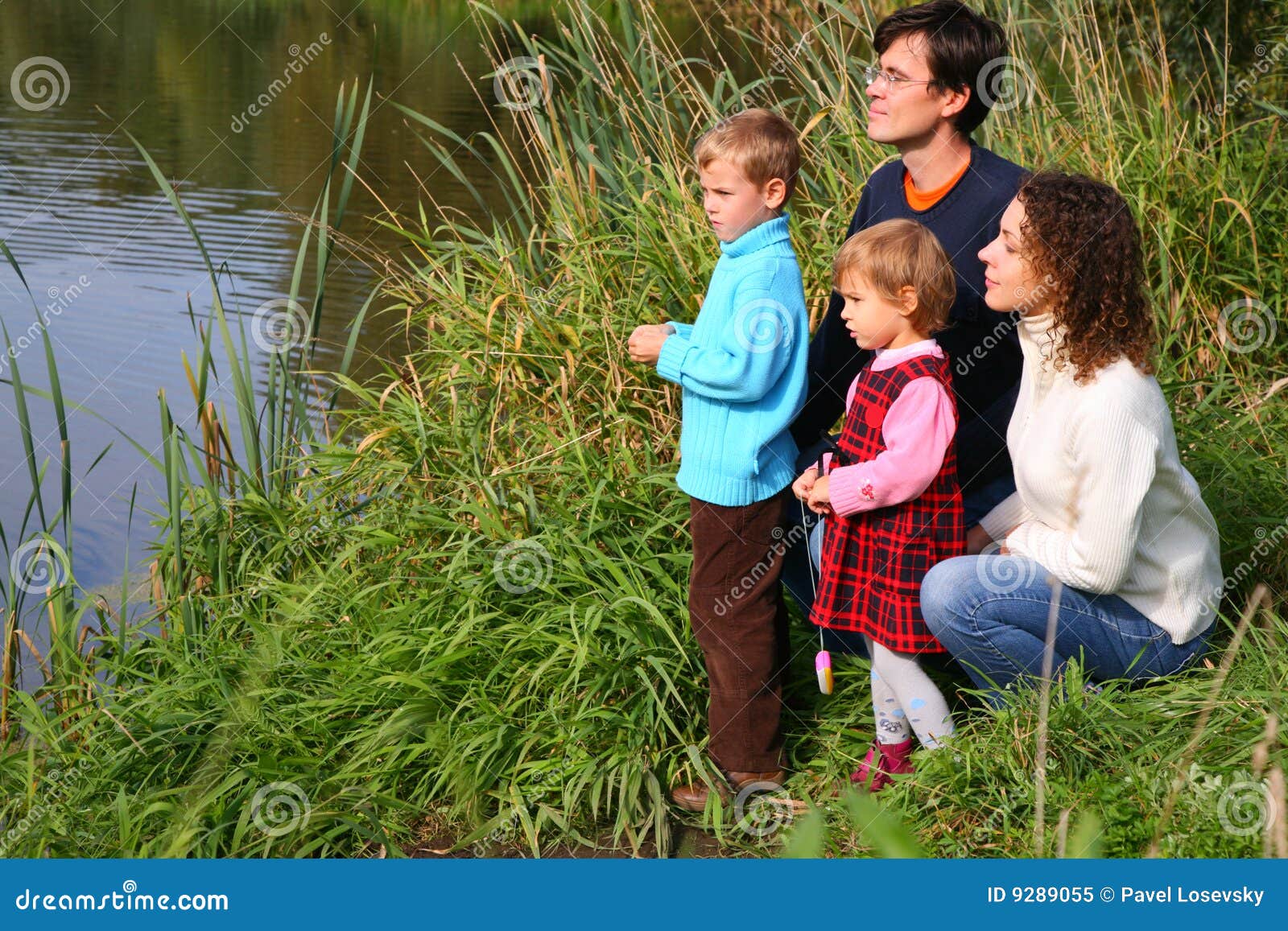 Parents with Children Sits on Bank of Pond Stock Image - Image of ...