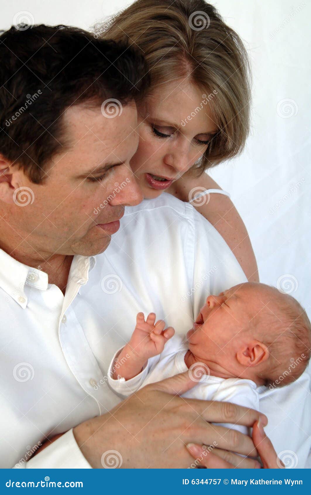 Parents with crying baby stock image. Image of baby, hands - 6344757