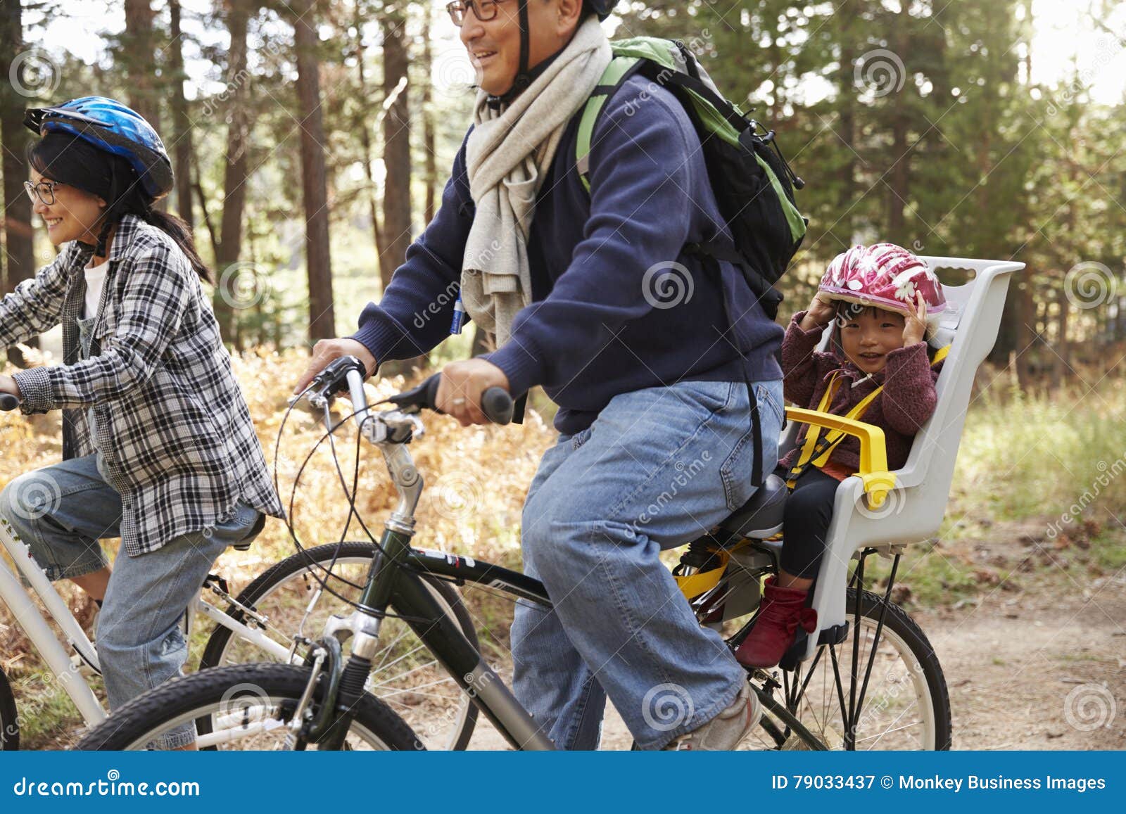Parents Cycling in a Forest with Toddler Daughter, Close Up Stock Image ... Parents Cycling in a Forest with Toddler Daughter, Close Up Stock Image ...
