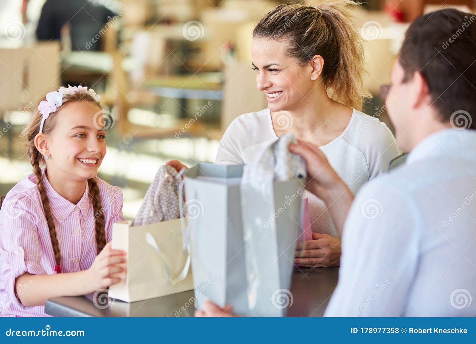 Parents with Daughter in Shopping Mall Stock Photo - Image of curious ...