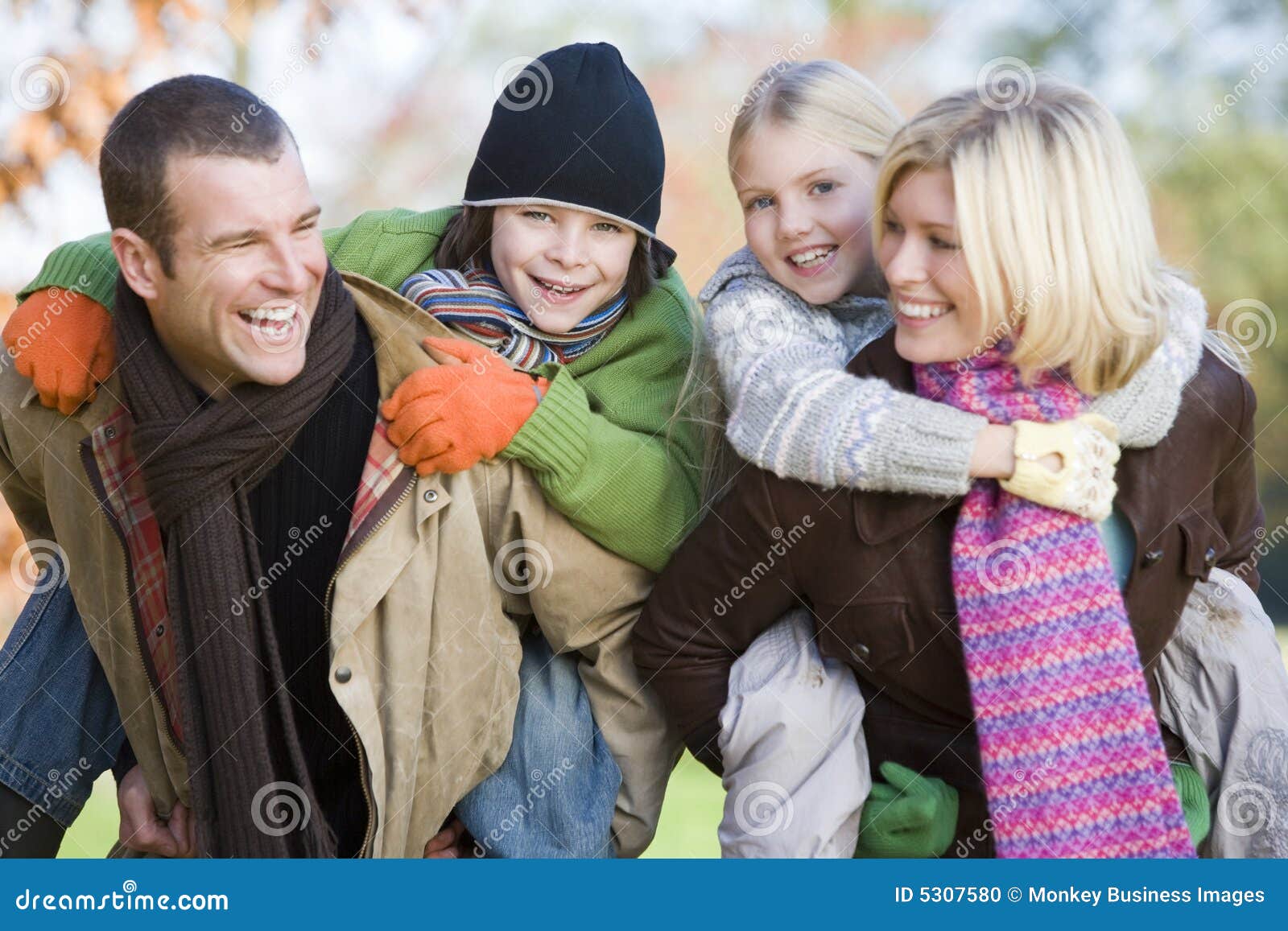 Parents Giving Children Piggyback Ride Stock Photo - Image of cosy ...