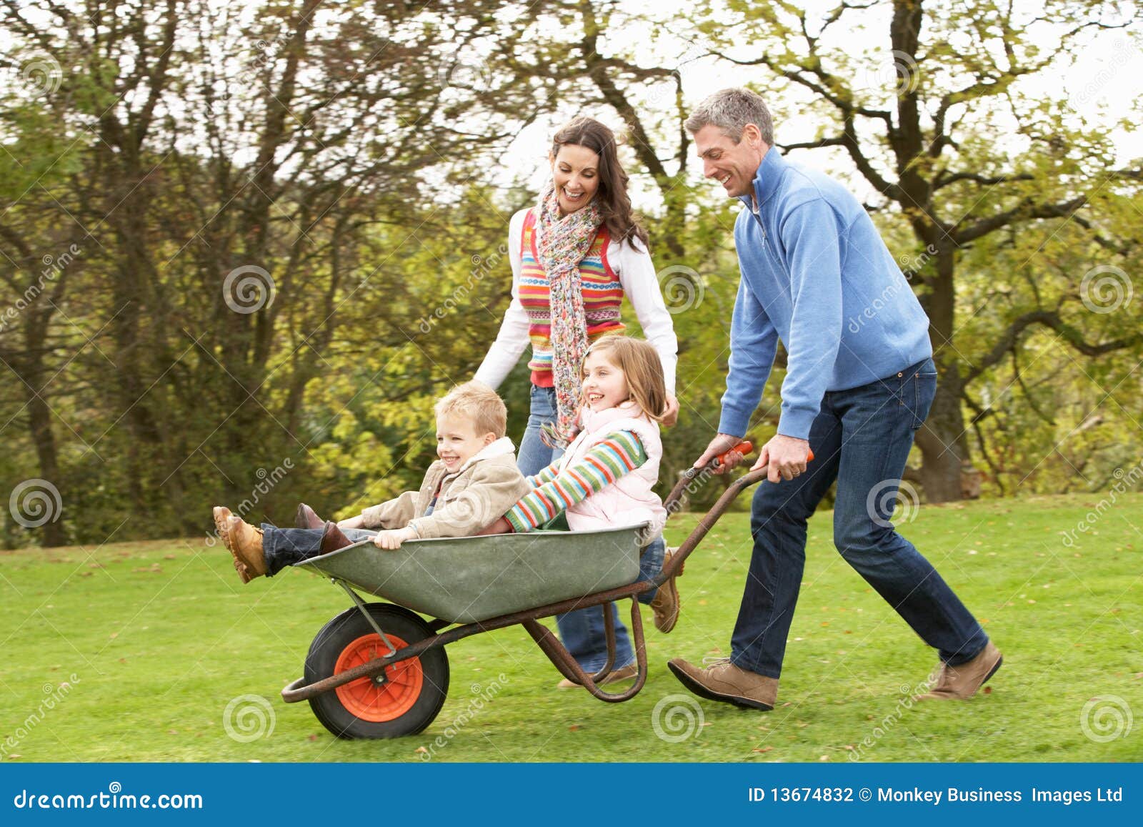 Parents Giving Children Ride in Wheelbarrow Stock Photo - Image of ...