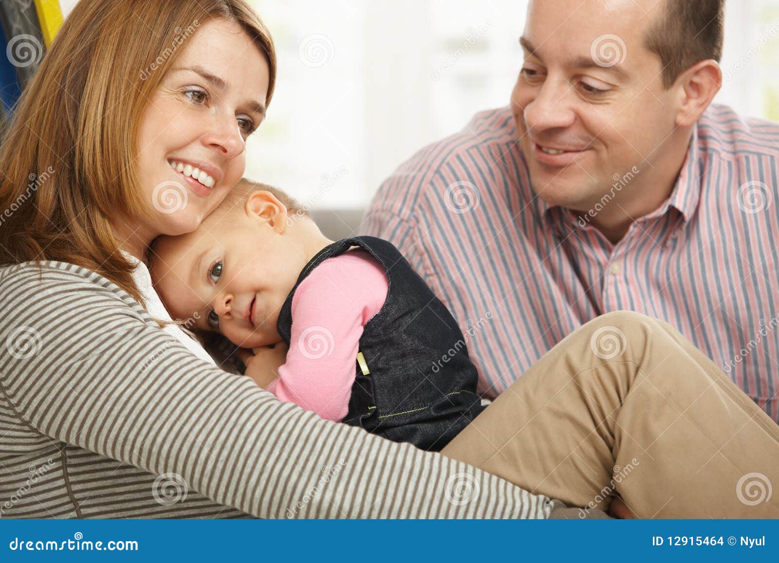 Parents with happy baby stock photo. Image of girl, daughter - 12915464