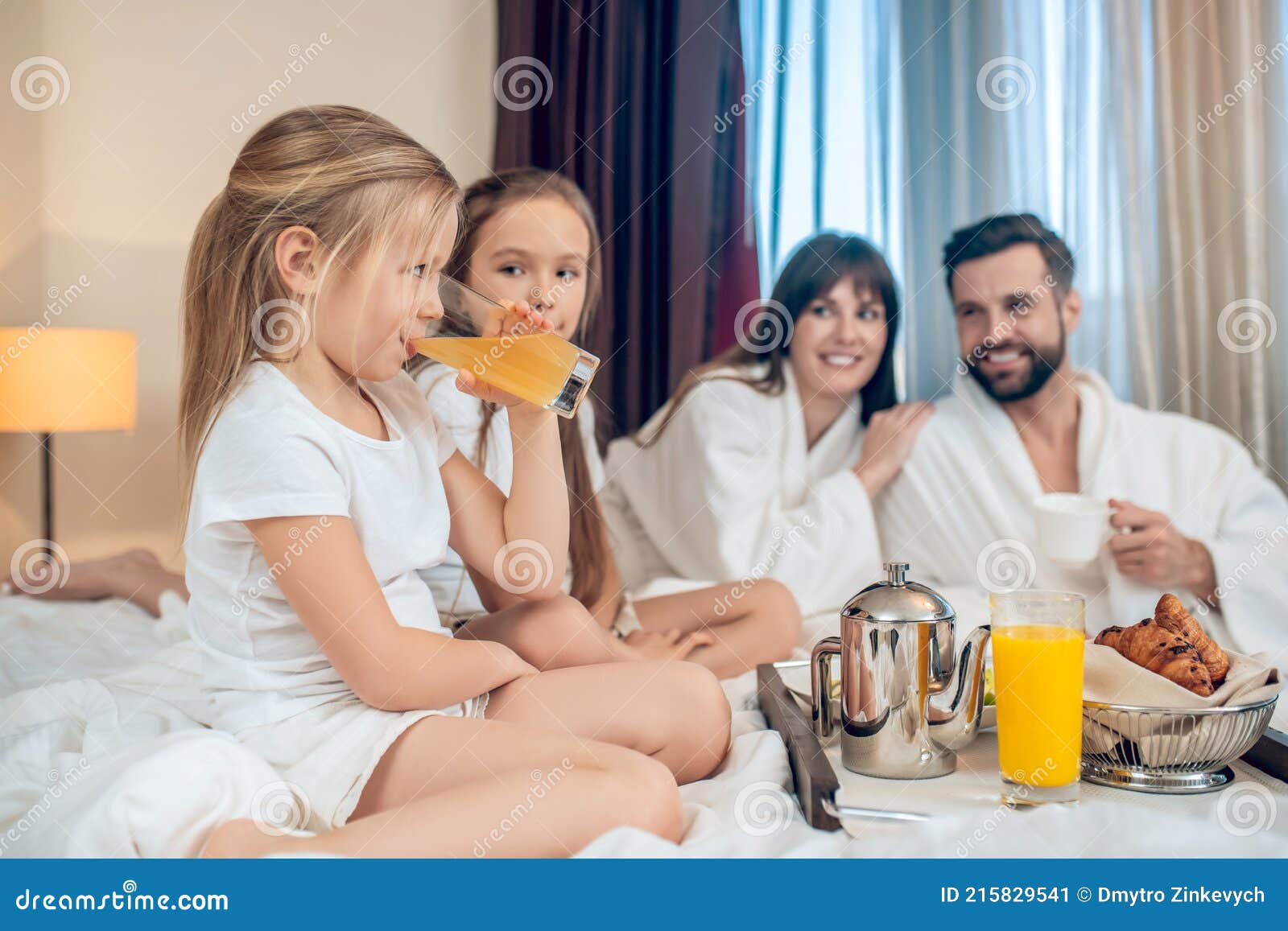 Parents and Kids Having Breakfast and Looking Contented Stock Image ...