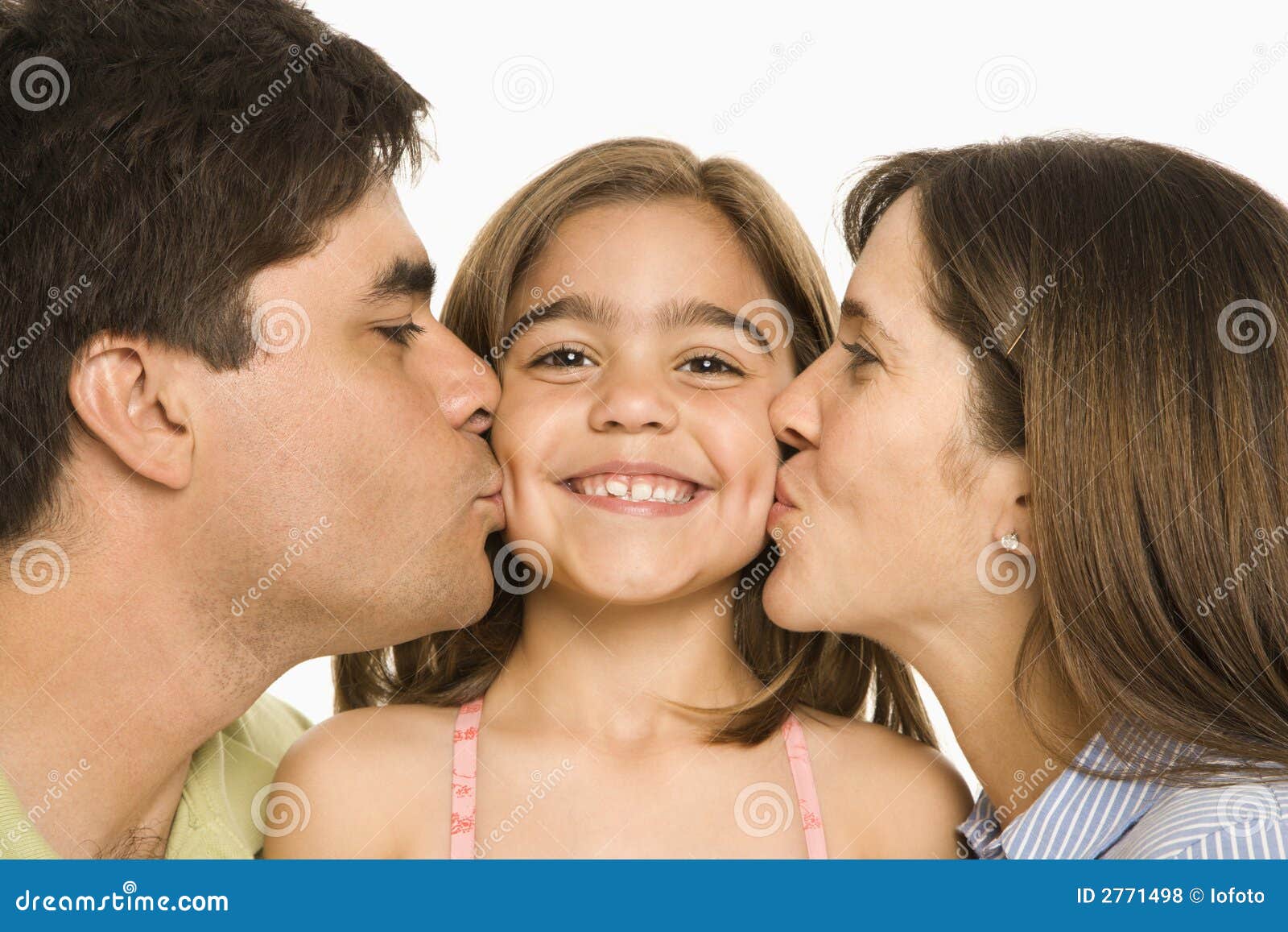 Parents kissing girl. stock photo. Image of color, child - 2771498