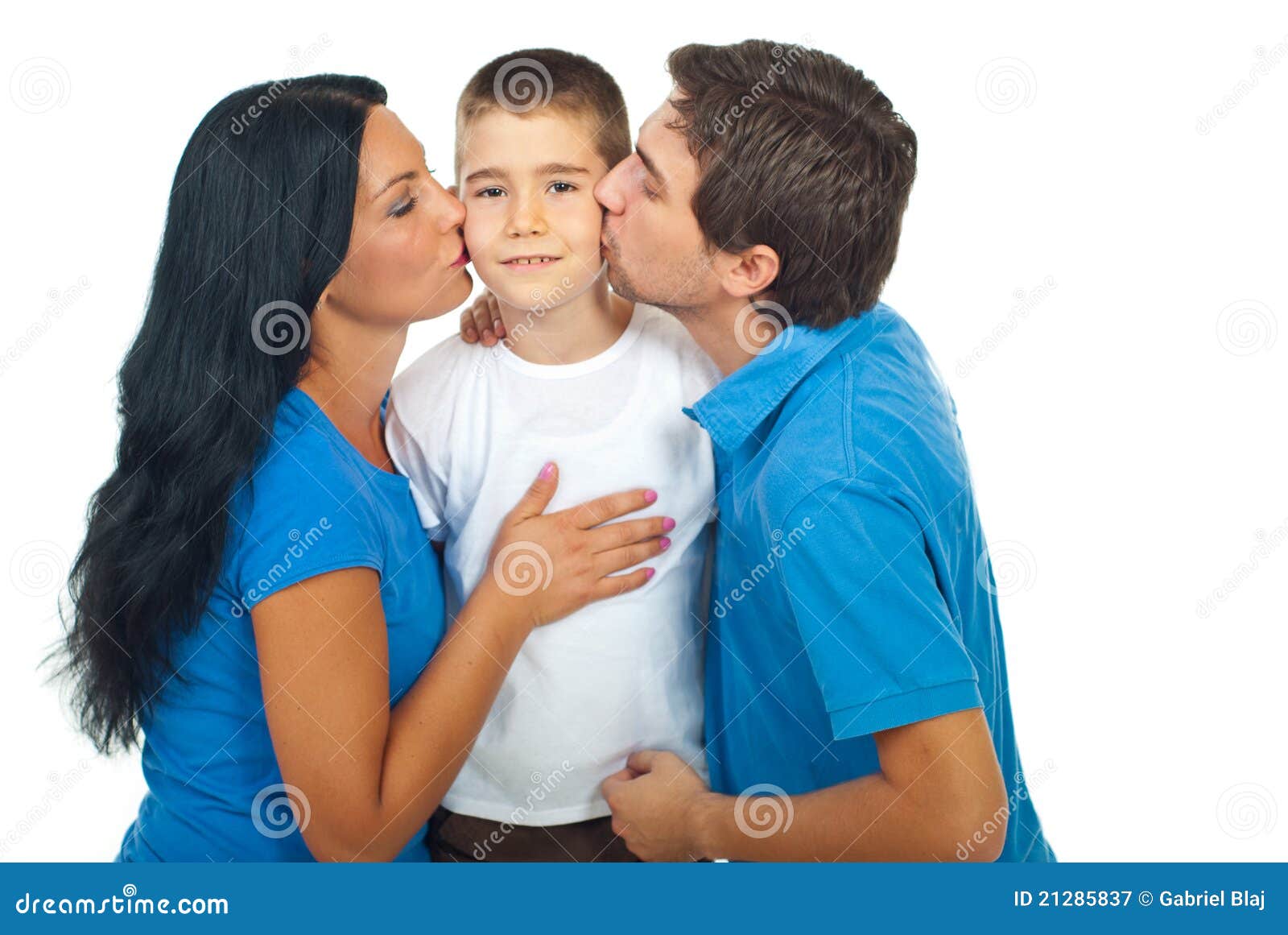 Parents kissing their son stock image. Image of clothing - 21285837