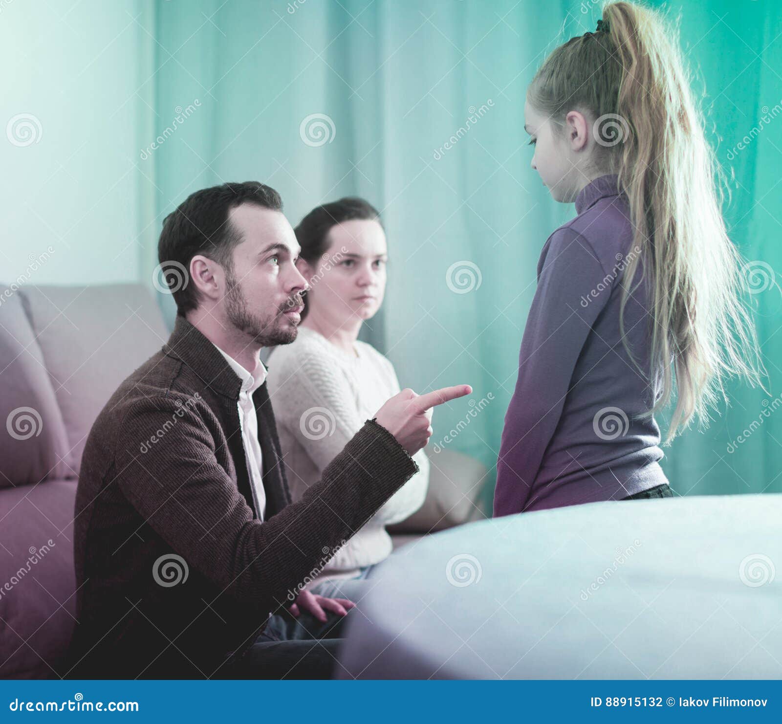 Parents lecturing daughter stock photo. Image of father - 88915132