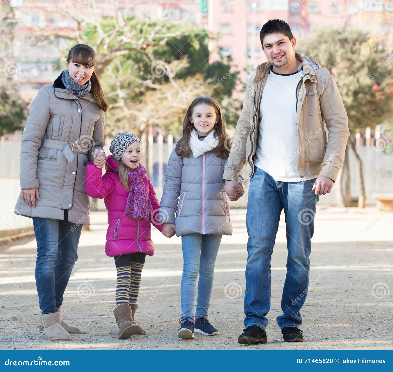 Parents and Little Daughters Taking a Walk in Park Stock Photo - Image ...