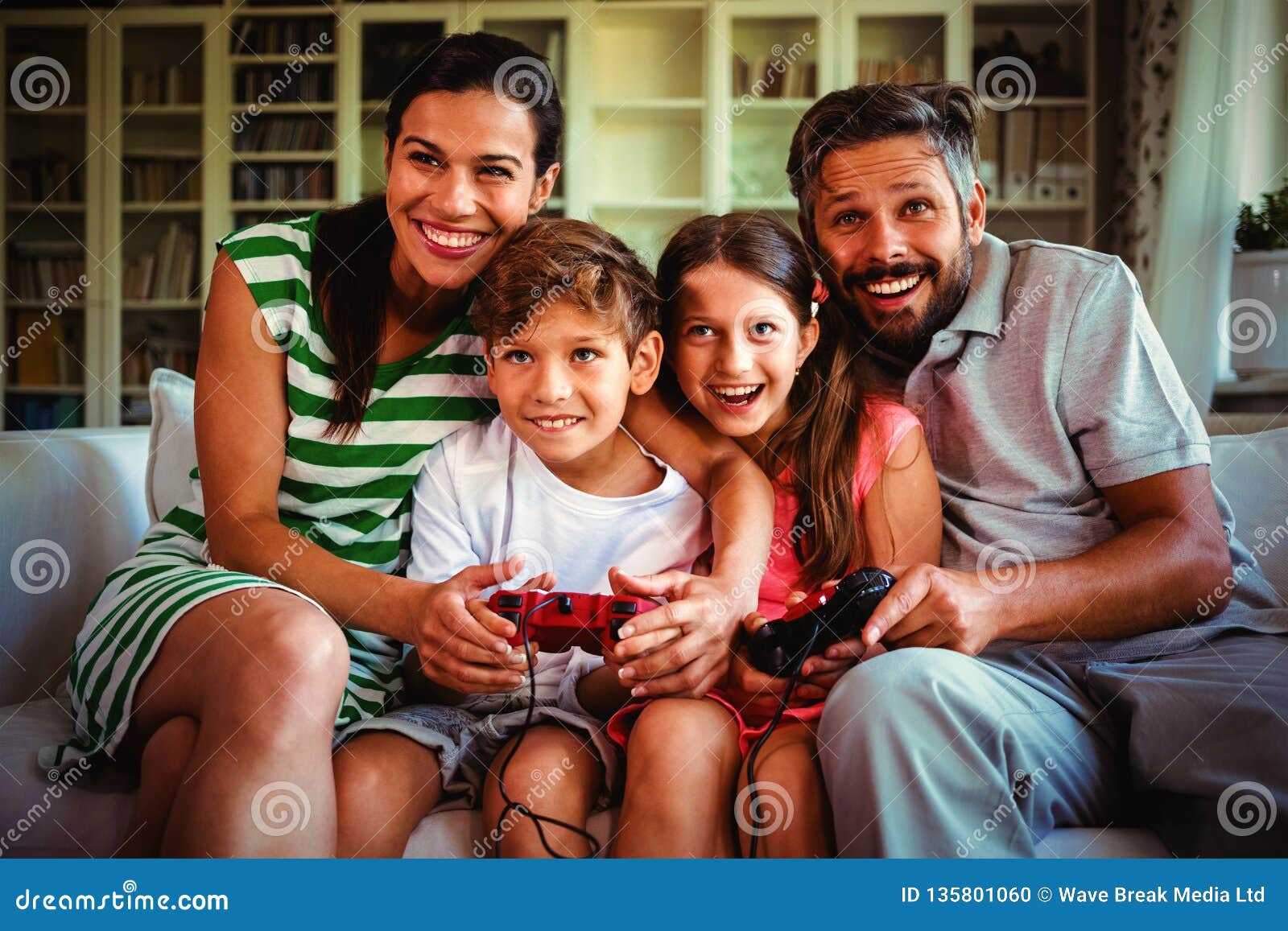 Parents Playing Video Games with Children Stock Photo - Image of ...